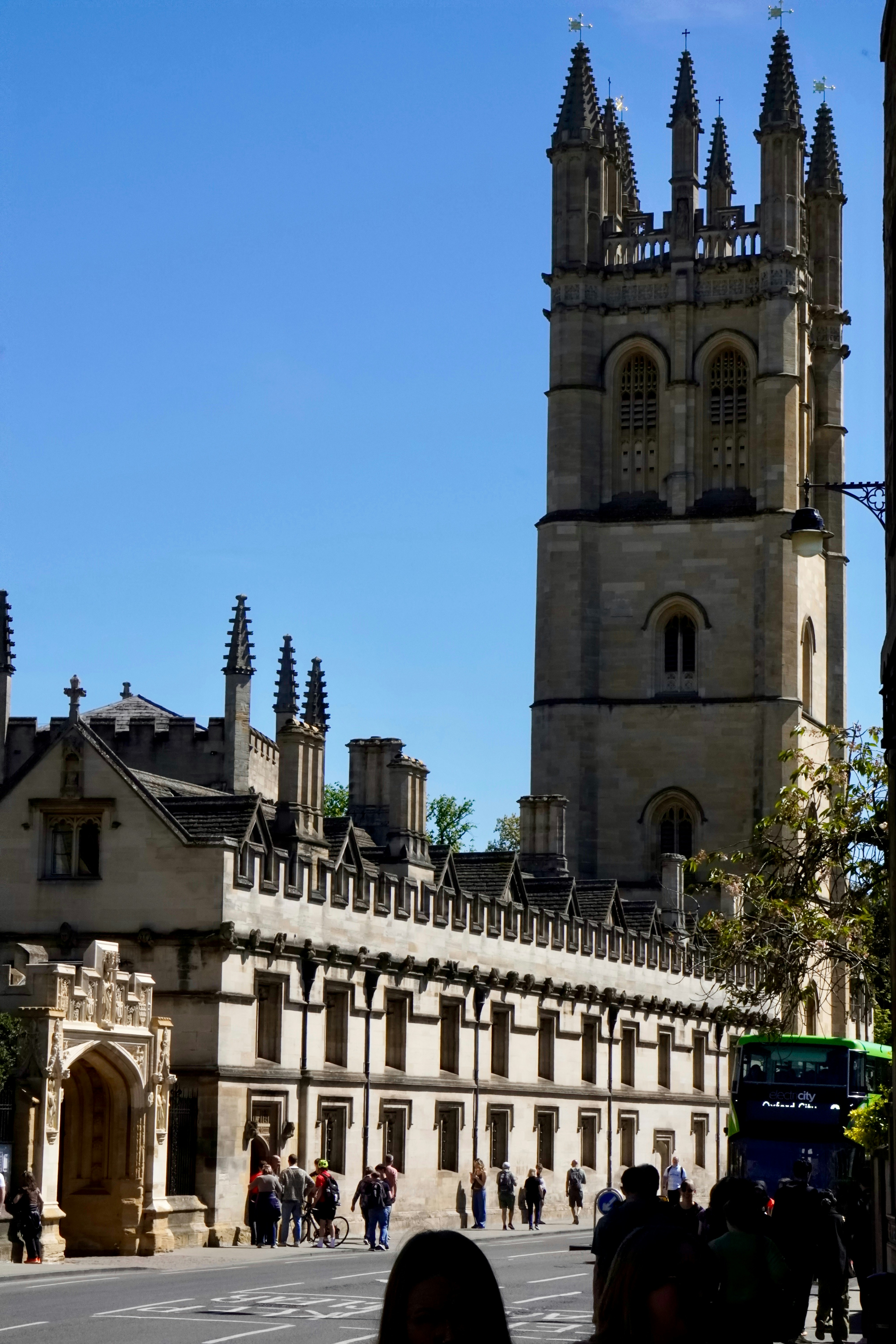 Gothic Tower Overlook: A Collegiate City Facade under Bright Sky