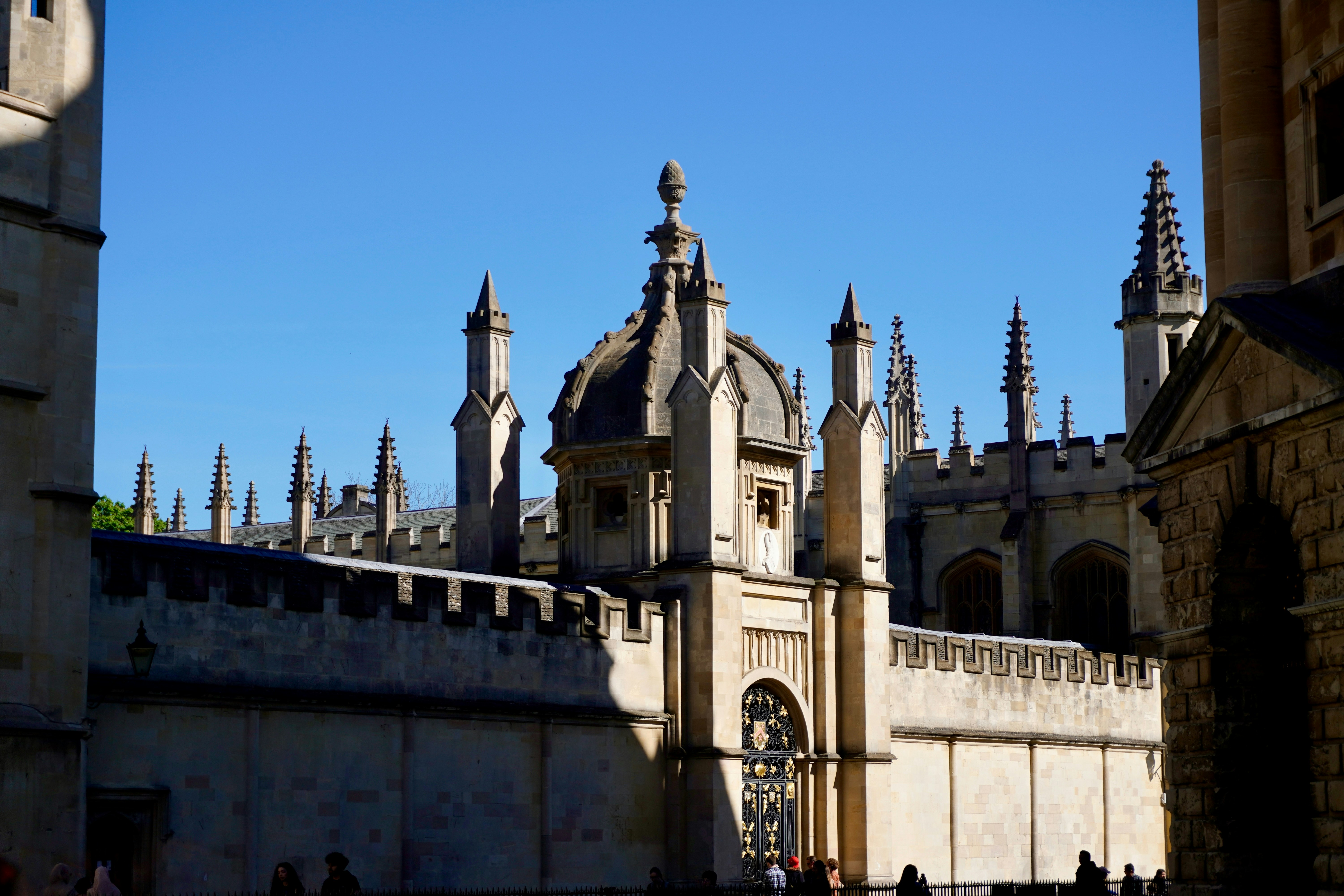 Gothic Courtyard Silhouette Under Clear Blue Skies