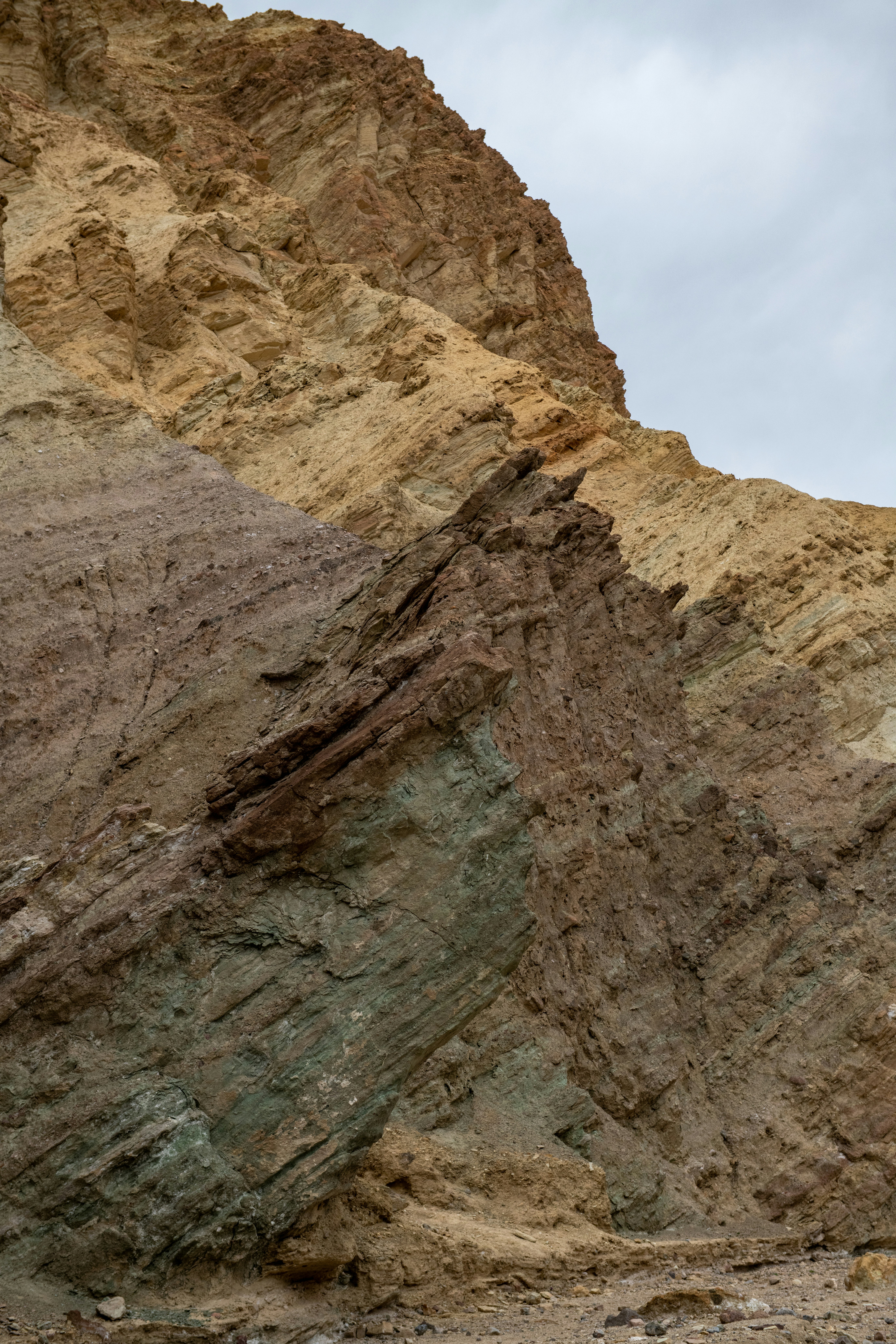 Stratified Cliffs: A Diagram of Earth’s Colors in Sunlit Erosion