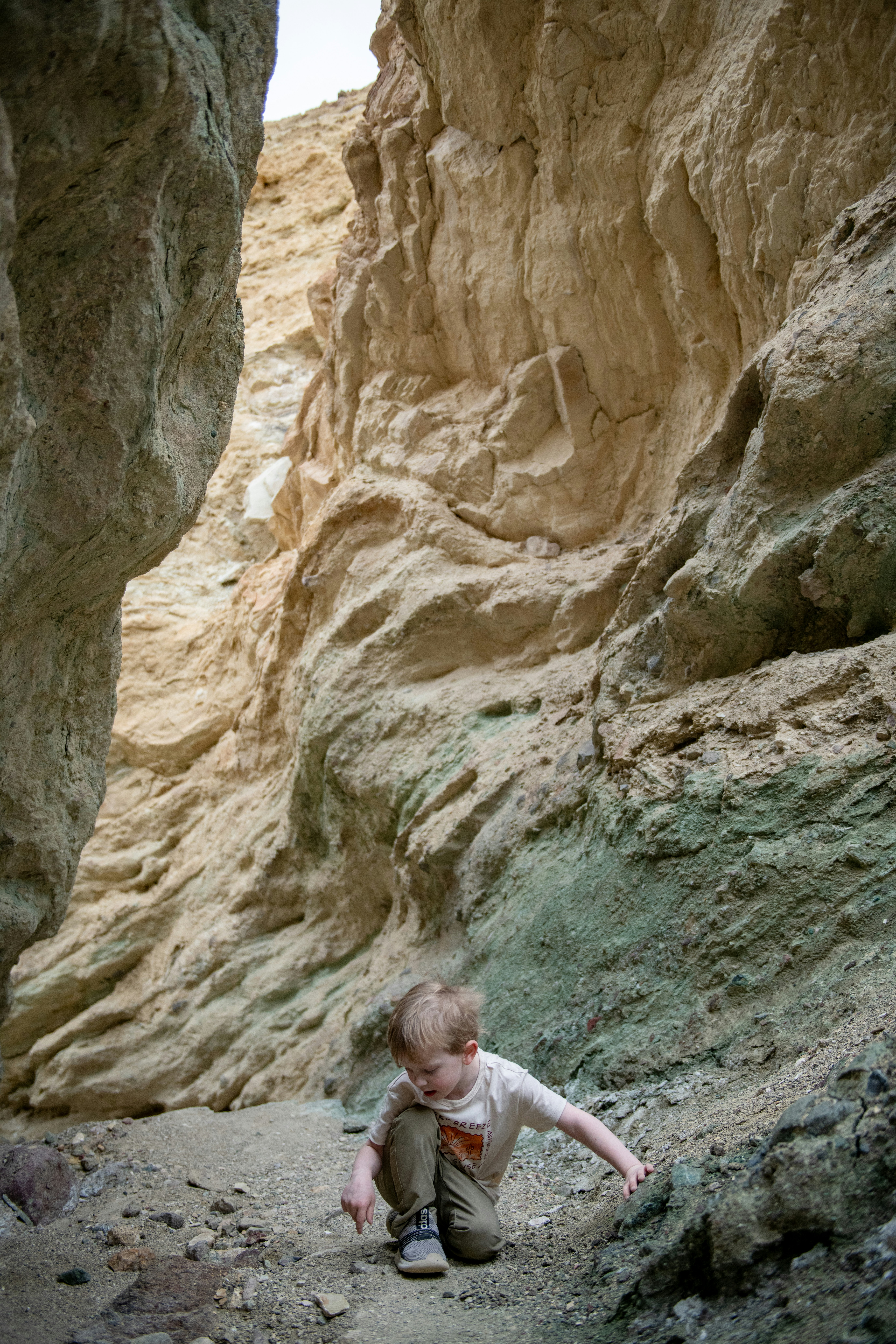Child in a Canyon: A Quiet Moment Among Weathered Rock