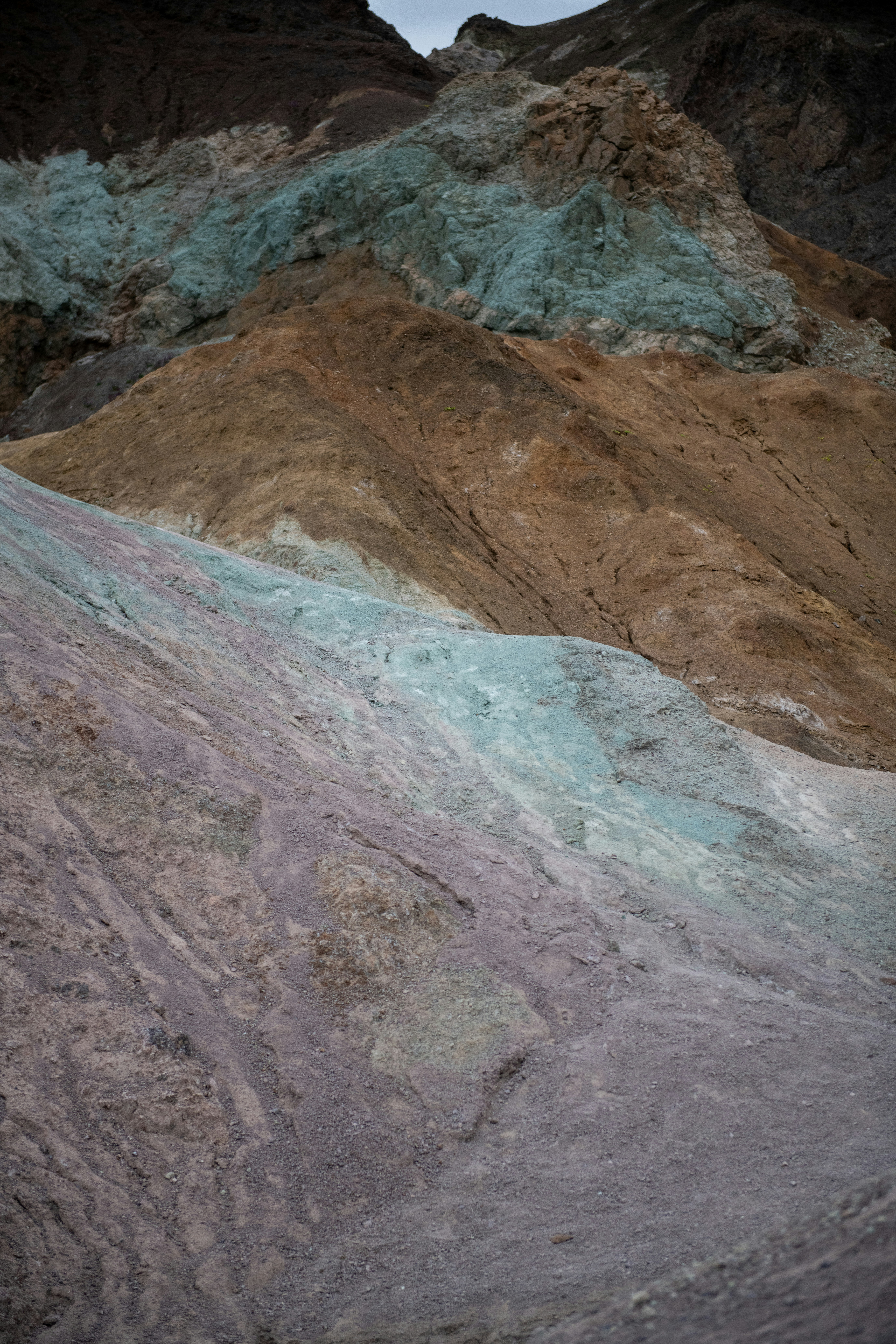 Pastel slopes: mineral strata under dawn-like light