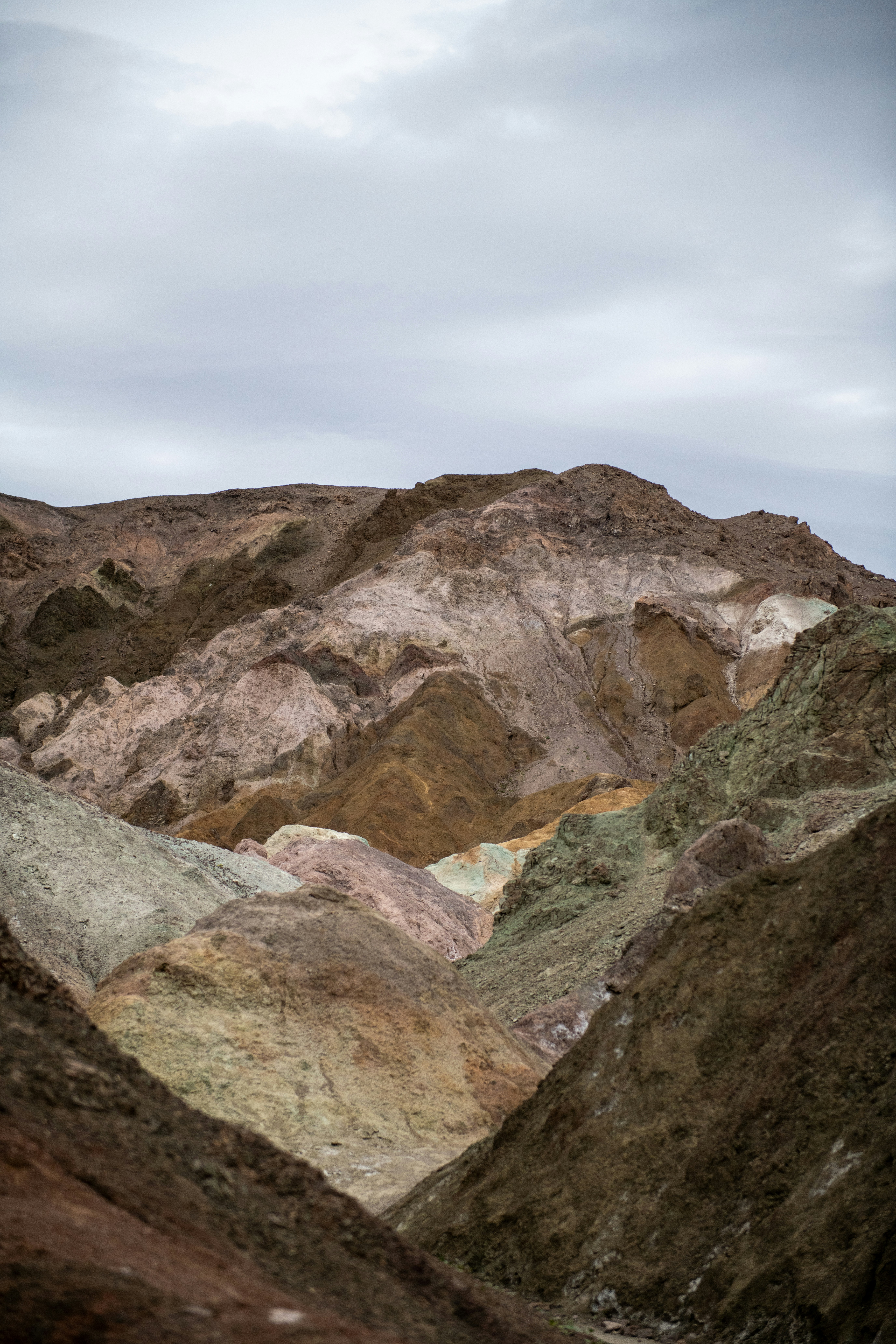 Chromatic Inversion: Rainbow Hills Under Quiet Skies