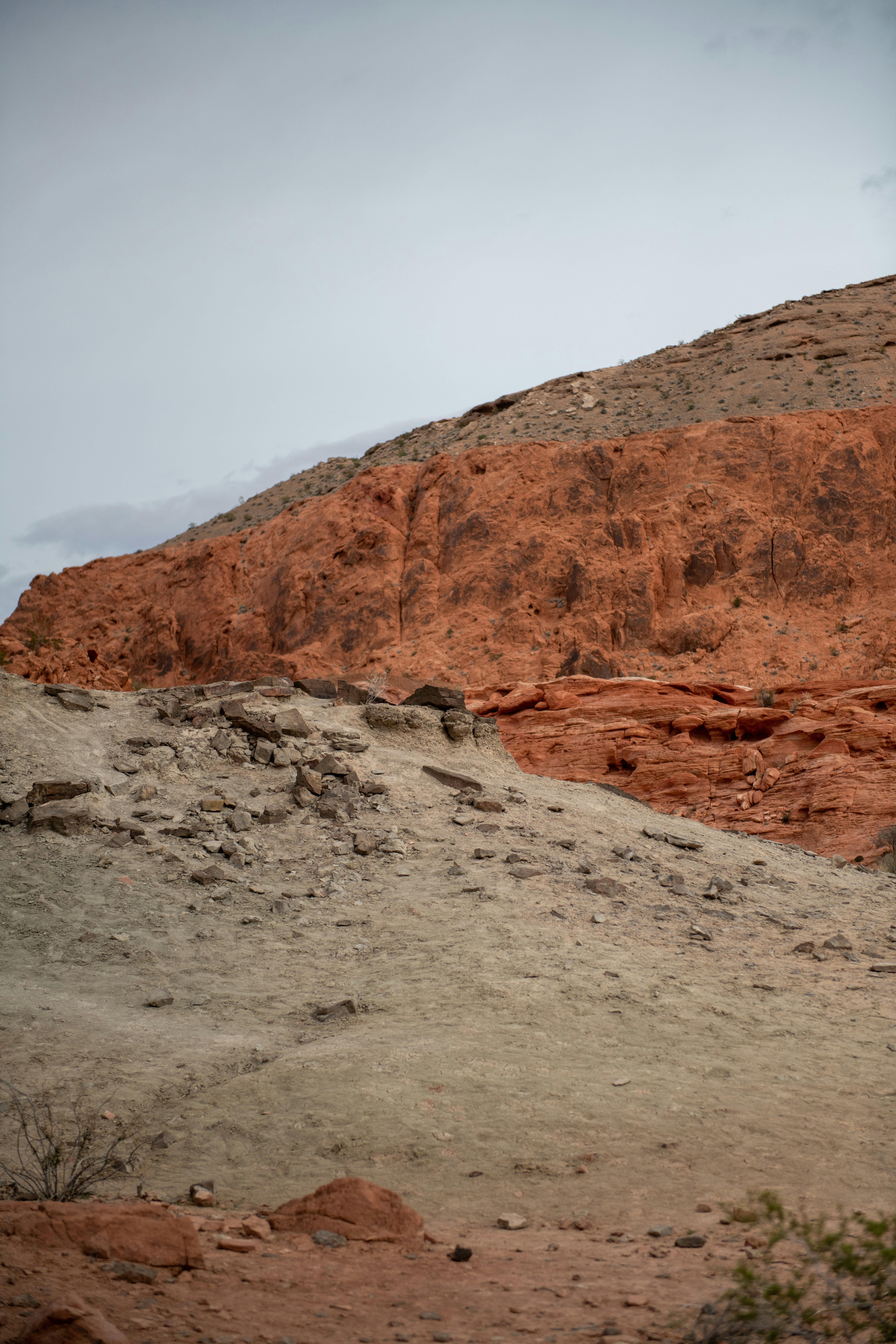 Red Cliffs Under a Pale Sky