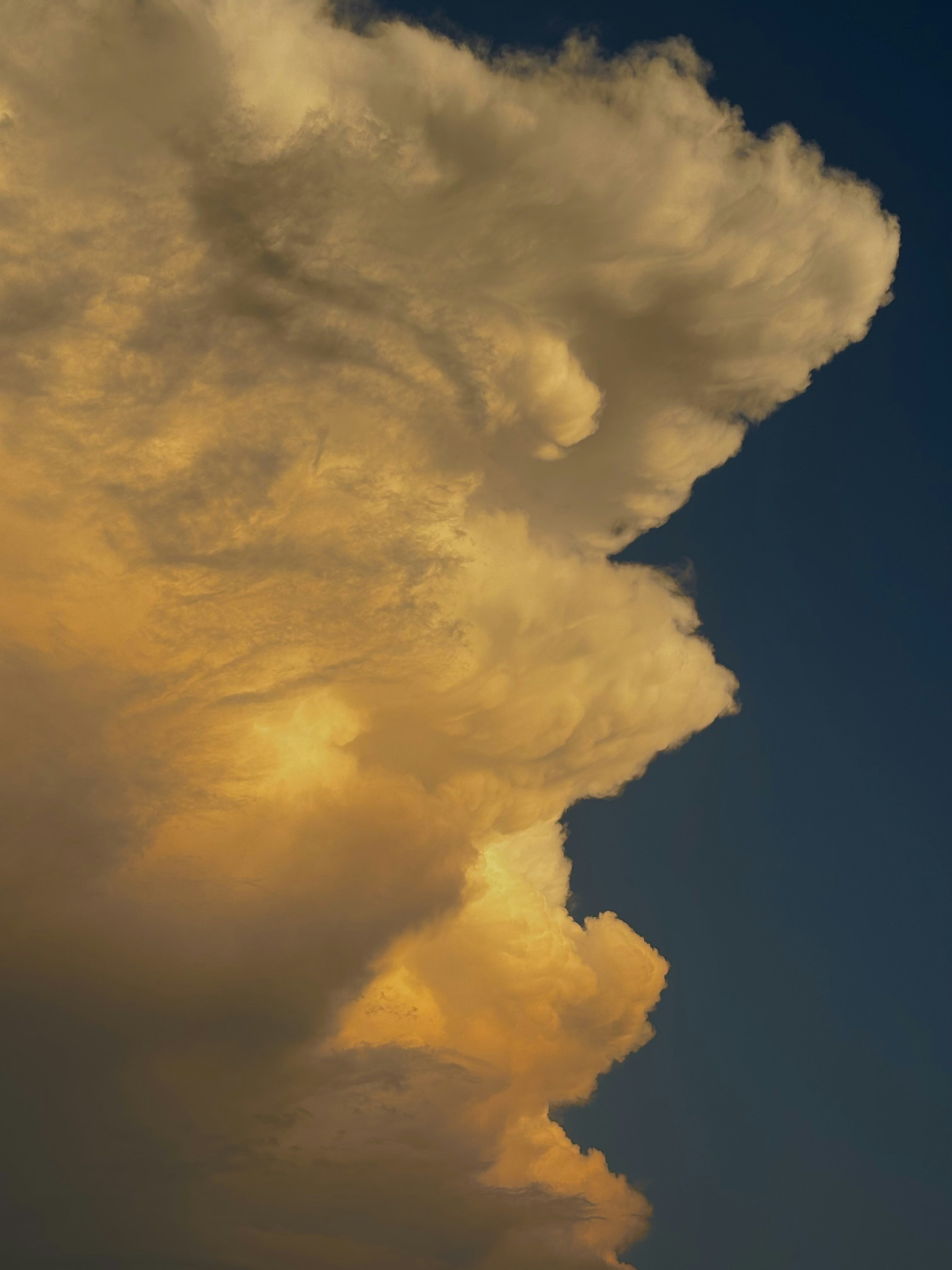 Golden Cloud Crown Against a Deep Sky