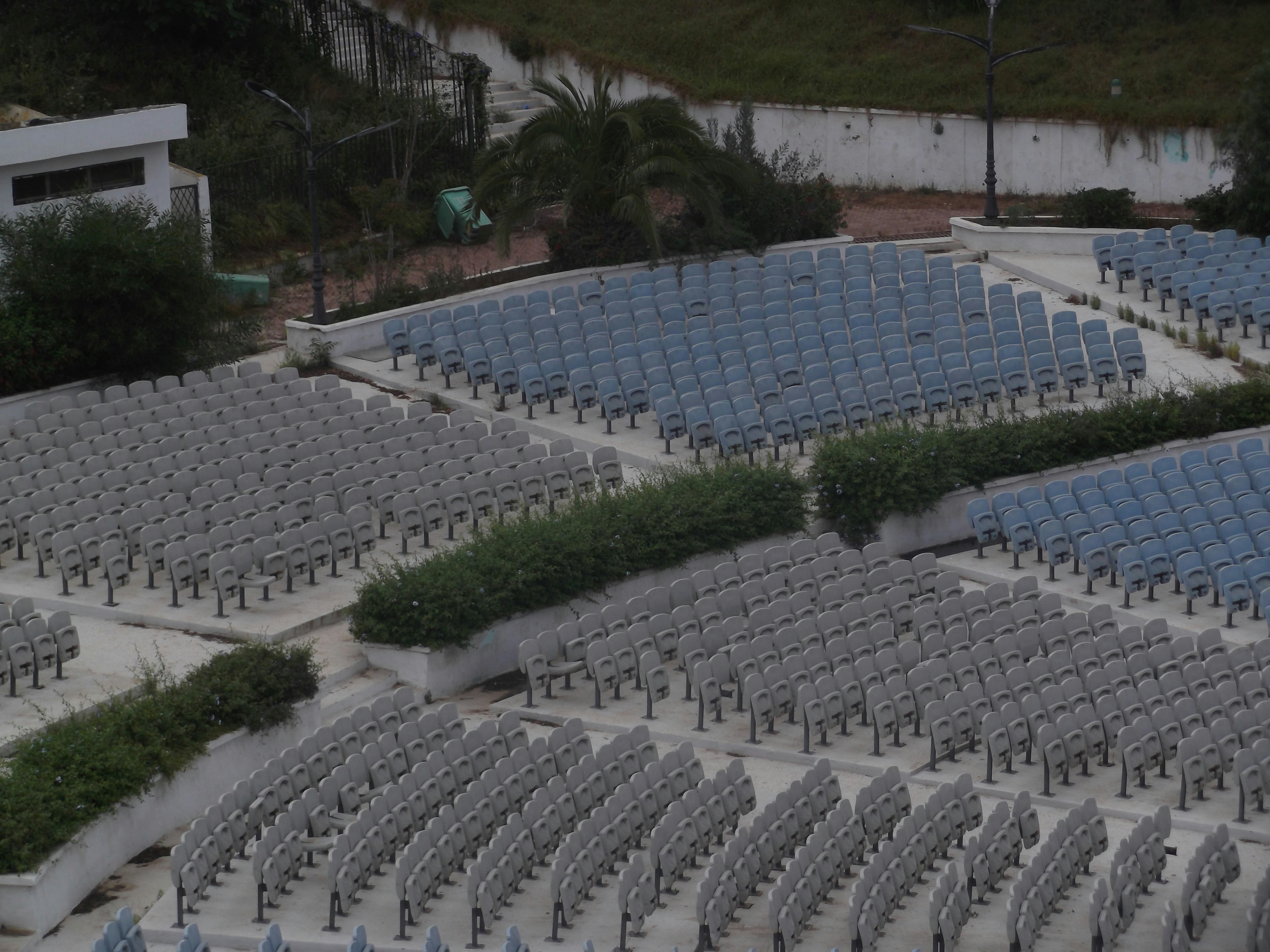 Silent Tiers of Concrete: An Empty Amphitheater at Dusk