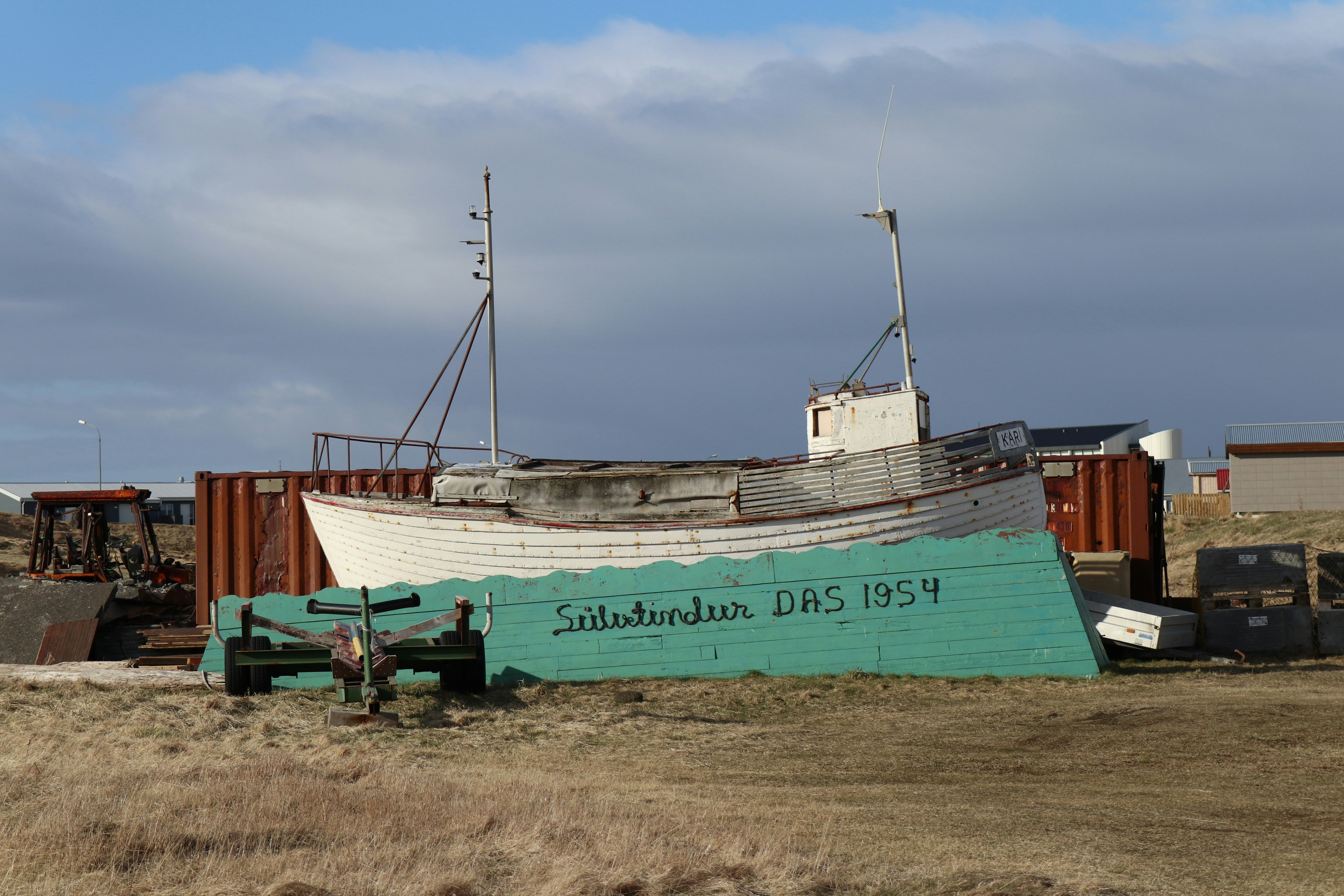 The Sunken Sail: Resting on Desert Grass