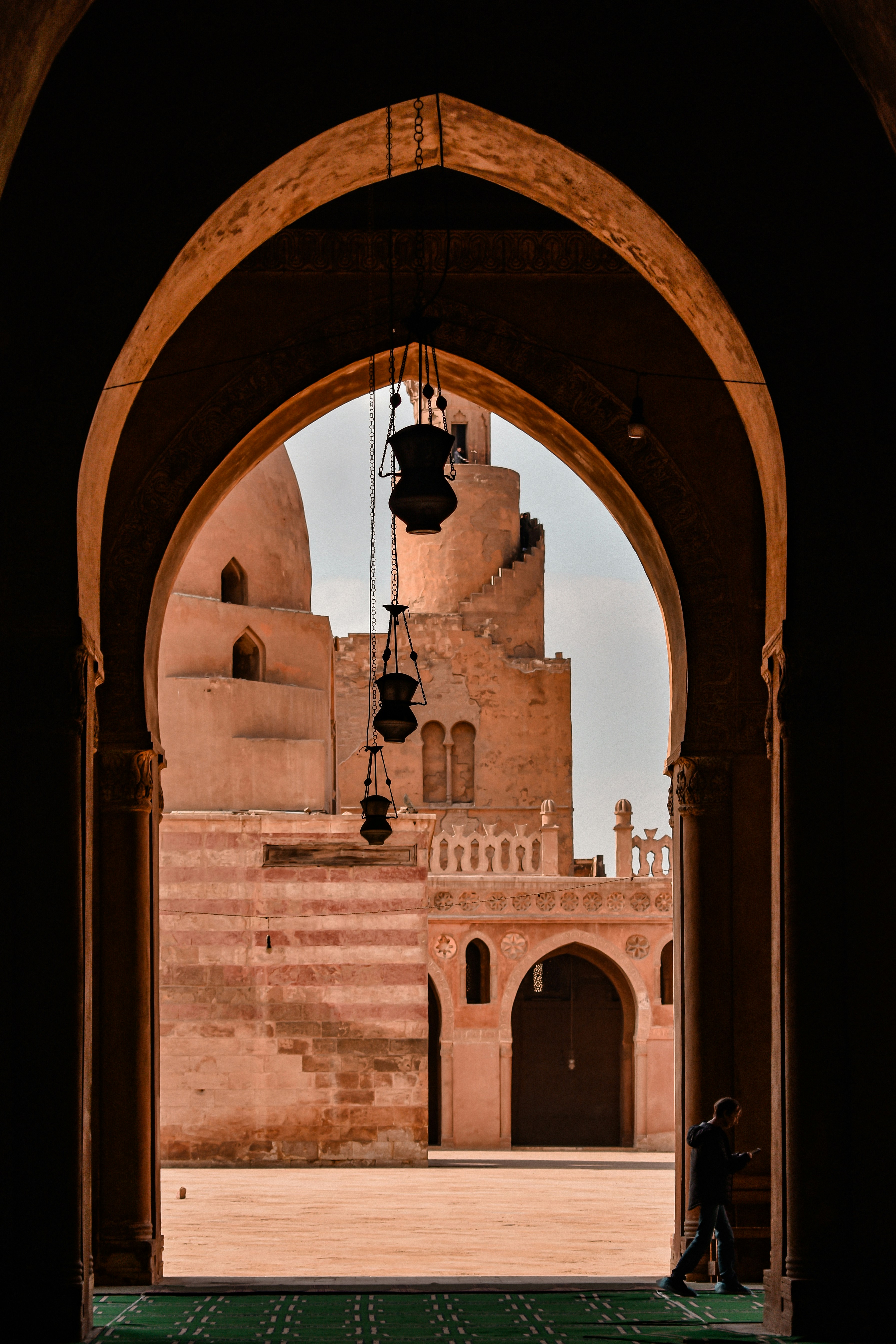 Gateway to the Deserted Courtyard: Archway Framing a Moorish Stronghold