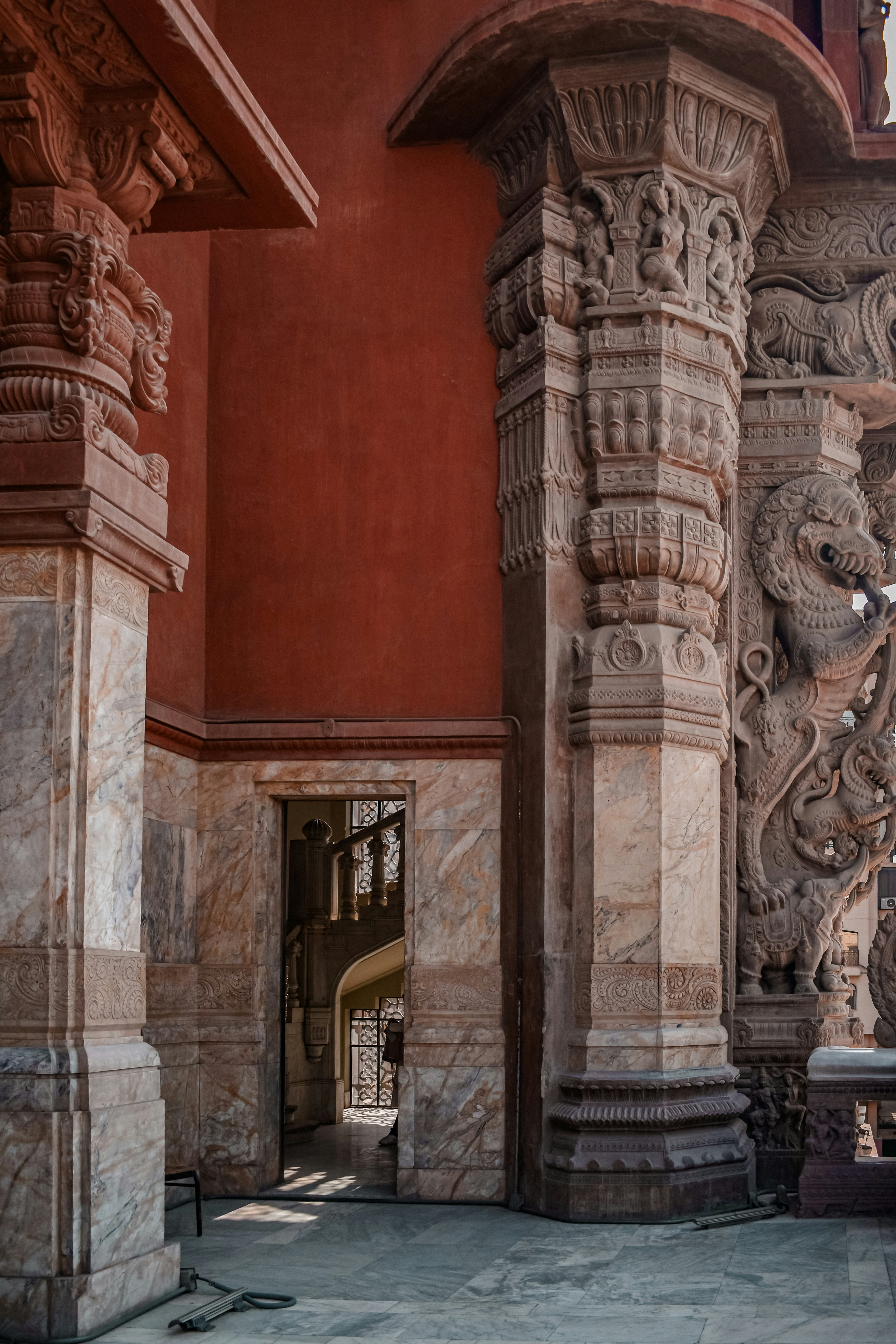Carved Portal: Ancient Marble Columns Guarding a Sunlit Archway