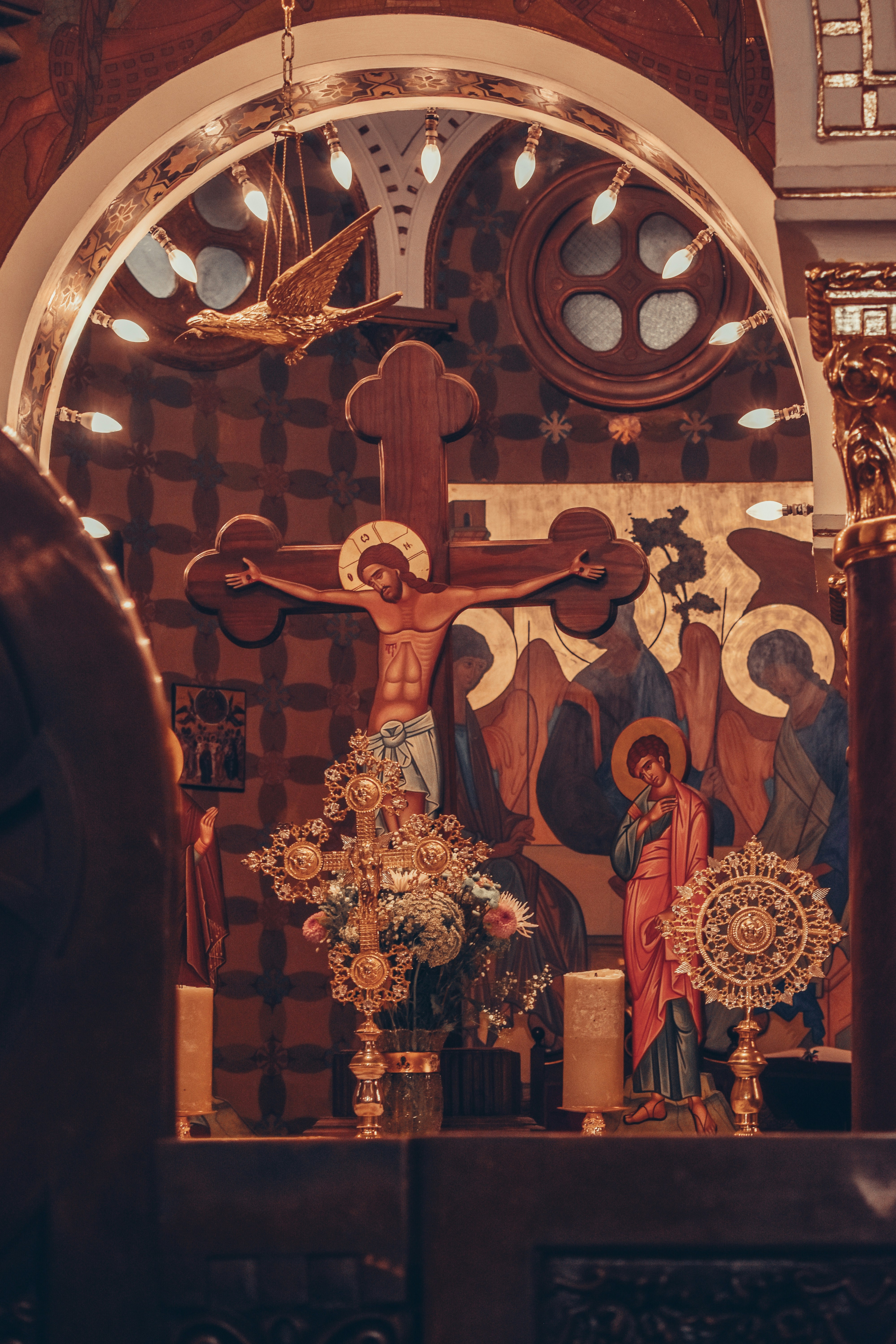 Cruciform Shrine: Golden Monstrance and Haloed Figures Framing Christ