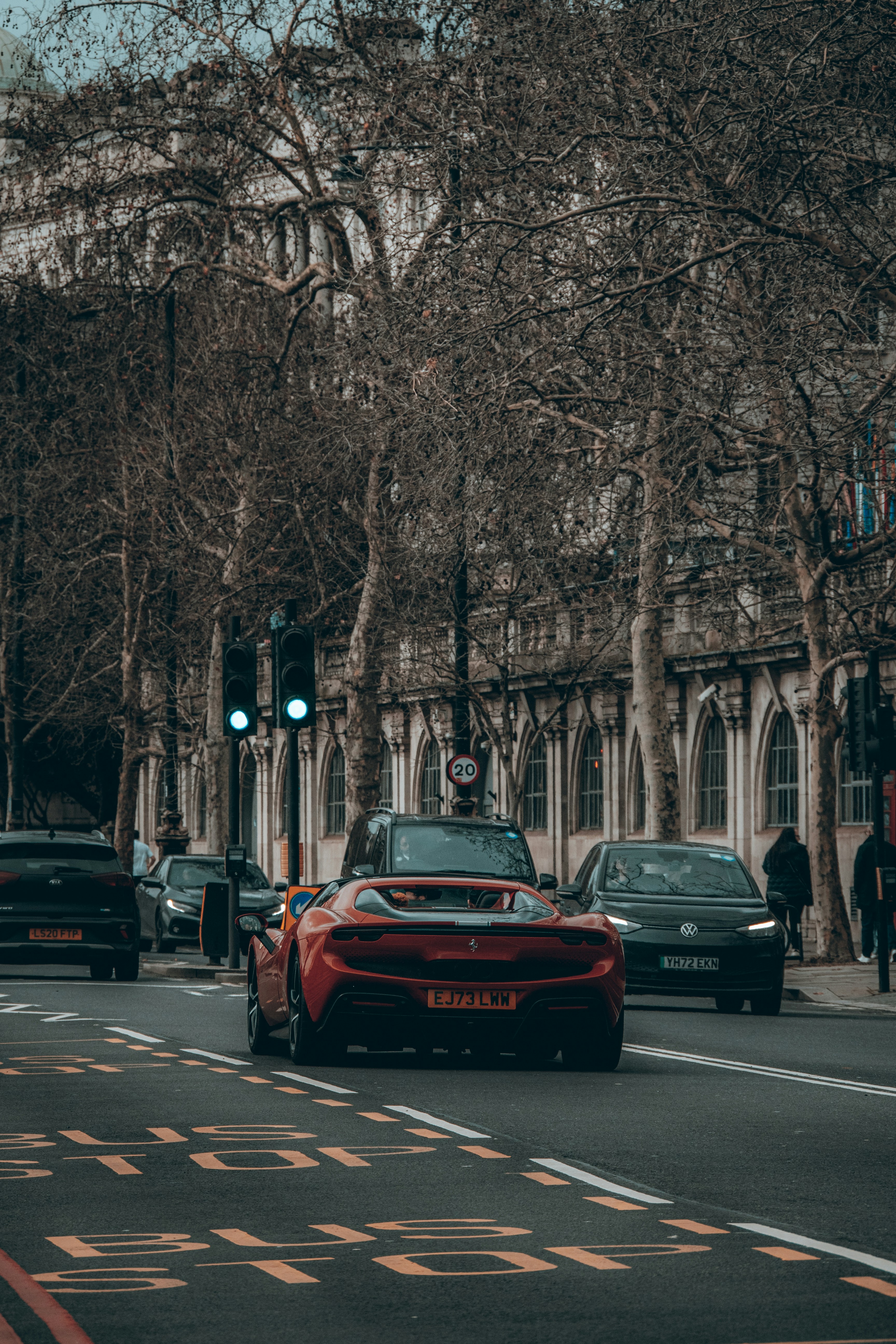 Red Convertible Poised at a City Crossroad