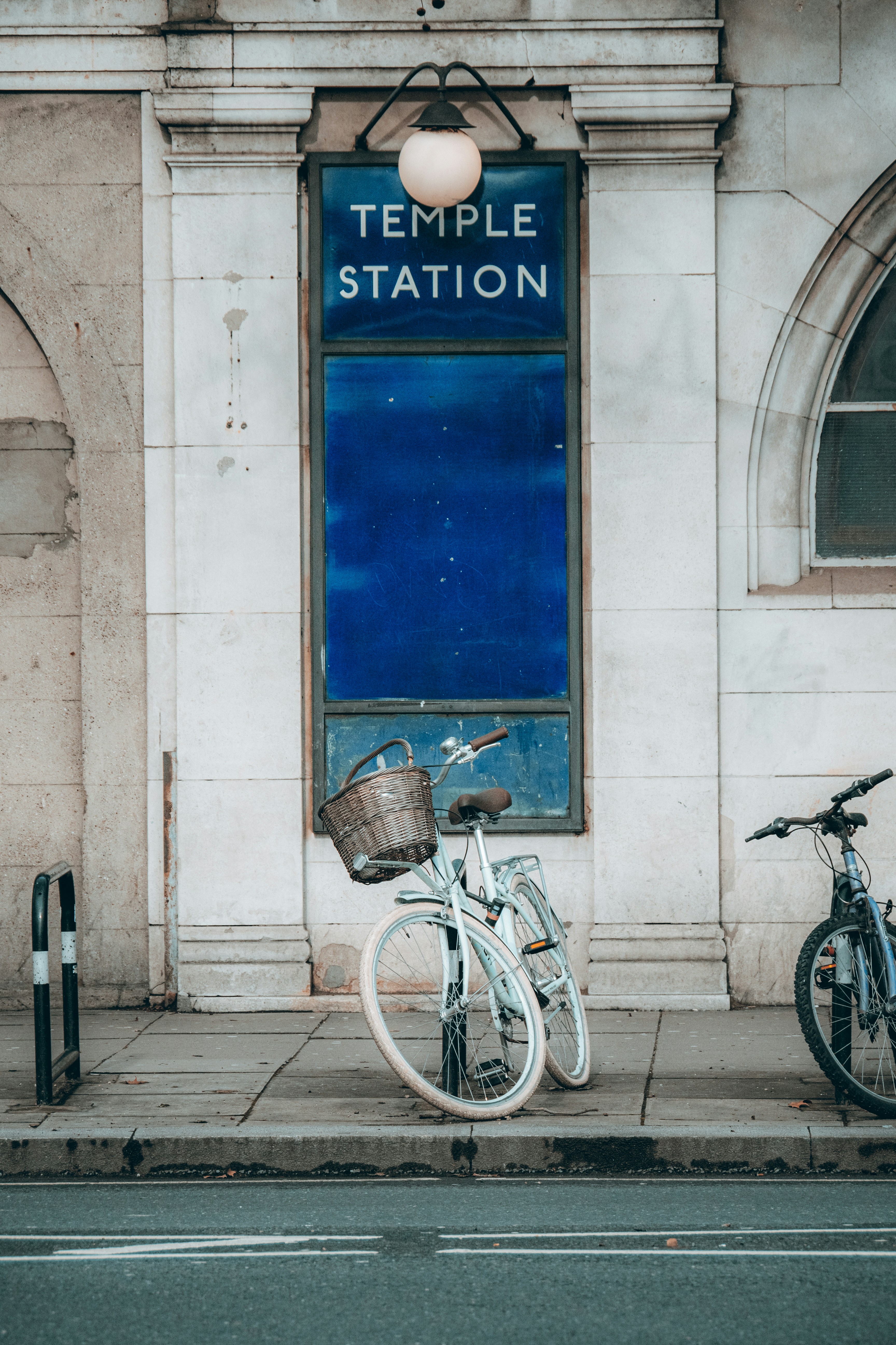 Bike in Front of a Blue-Panelled Temple Station Facade