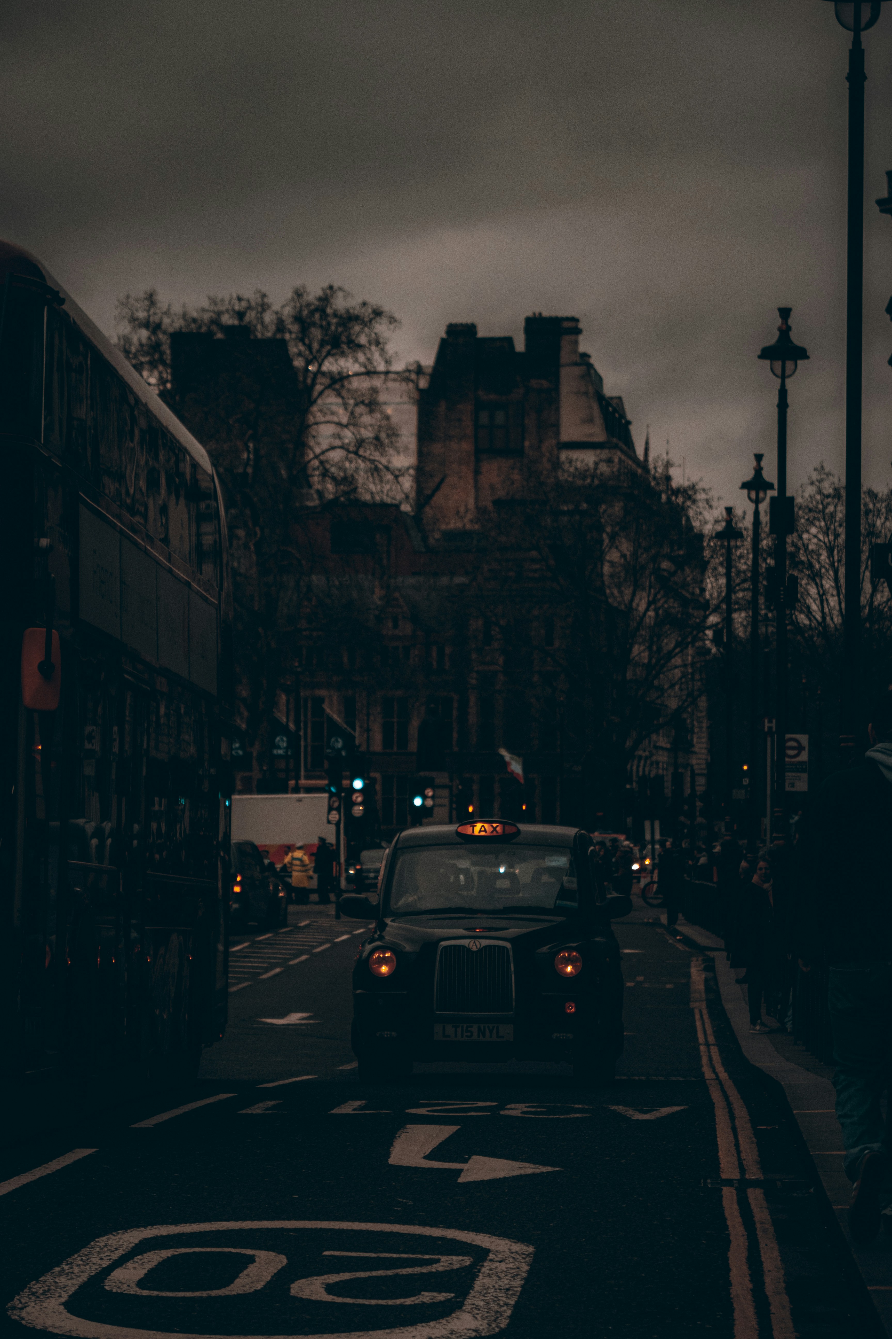 London Street at Dusk: A Taxi Haunting the Quiet Arc