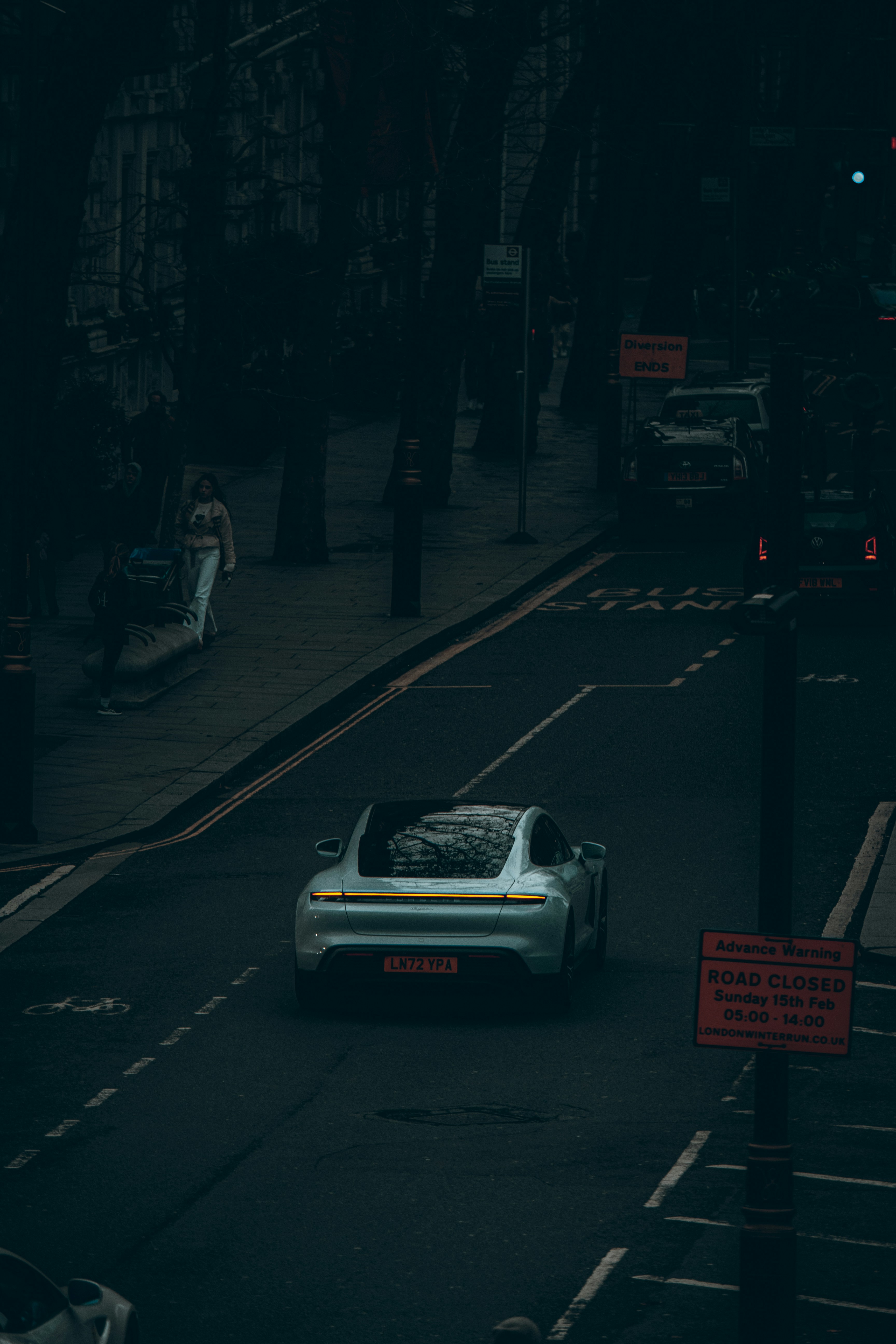 Electric Night Run: A White Sports Car Under City Gloom