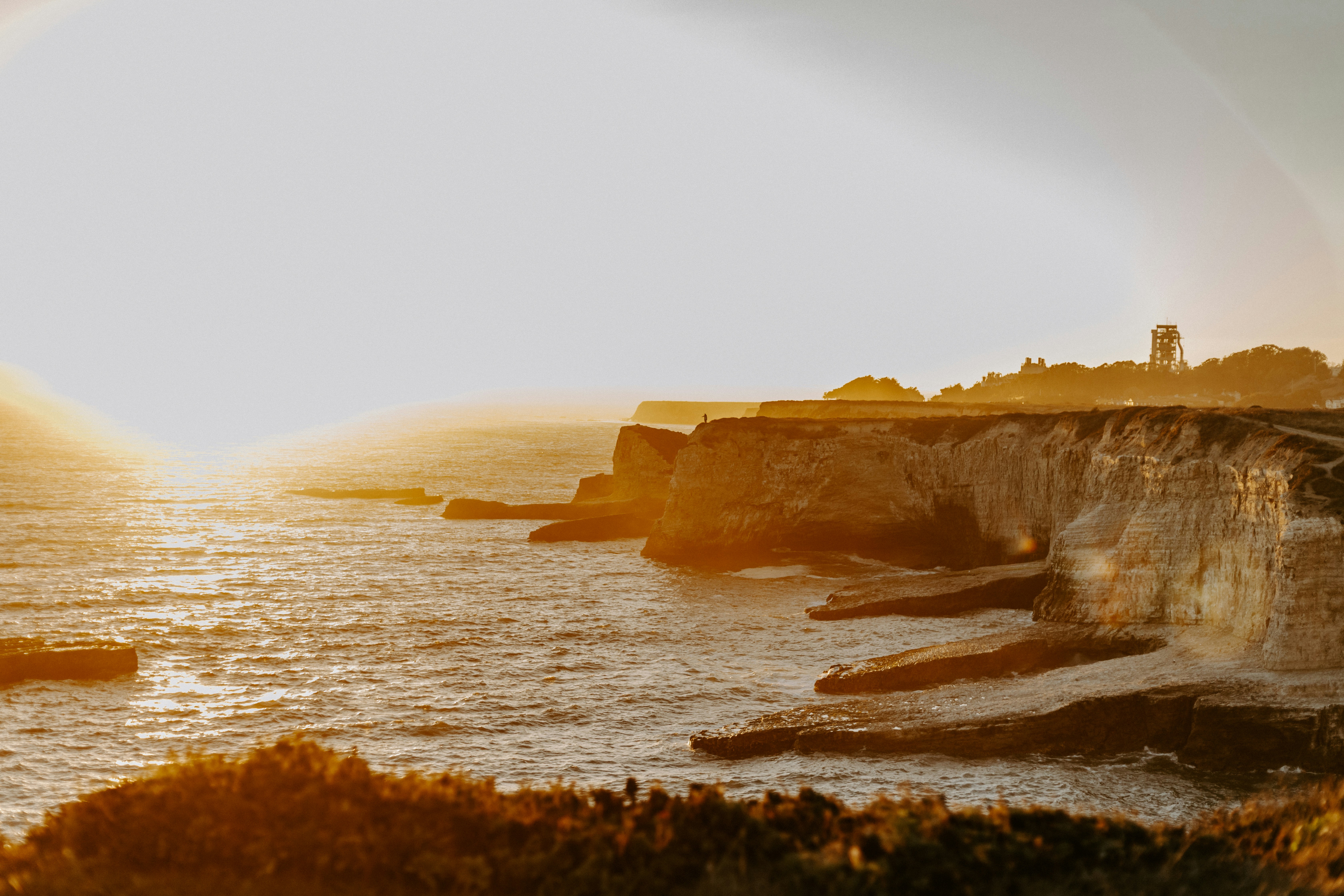 Golden Cliffs at Sunset Over Quiet Sea