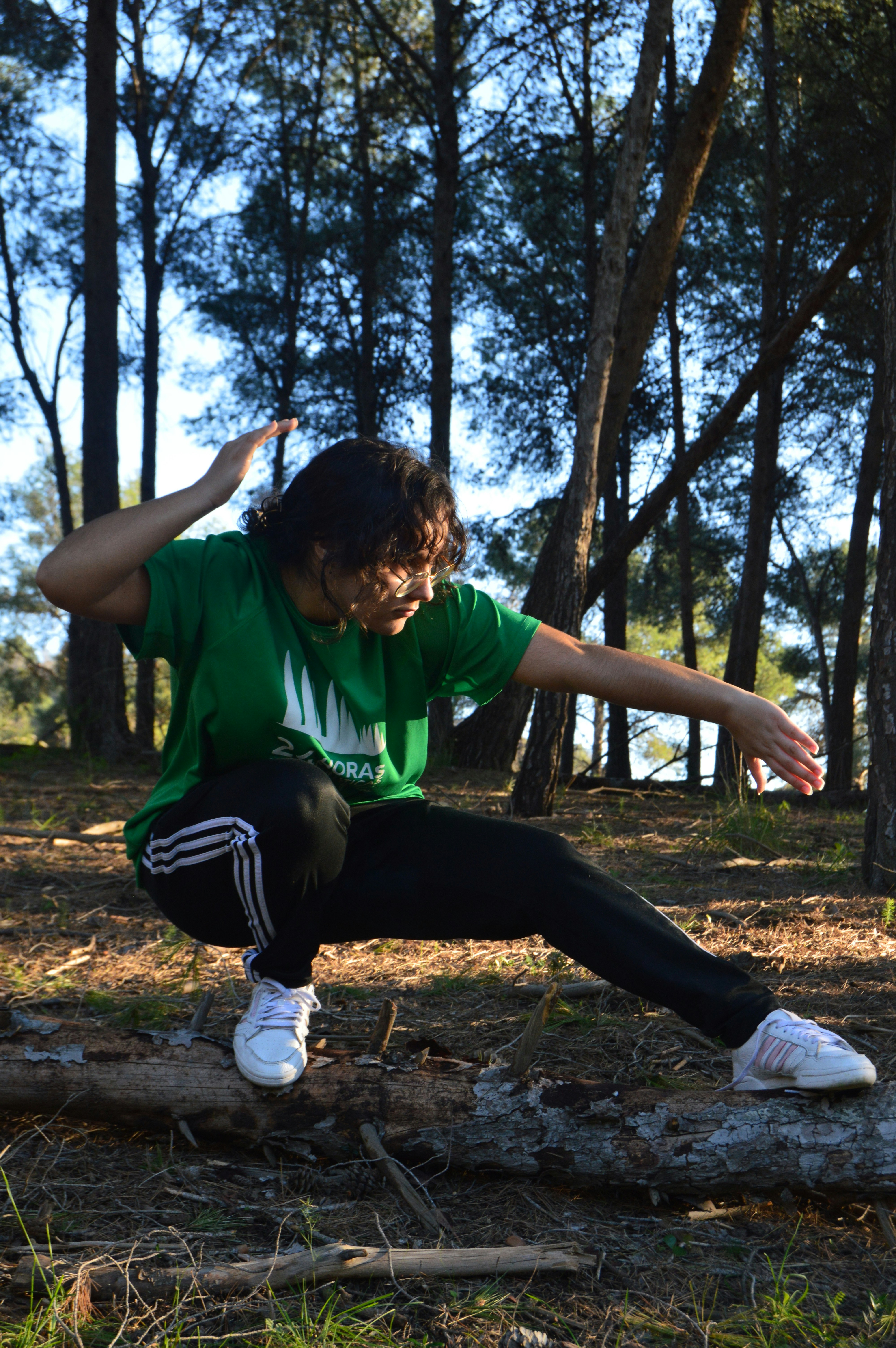 Dynamic Forest Balance: A youth in motion on a fallen log