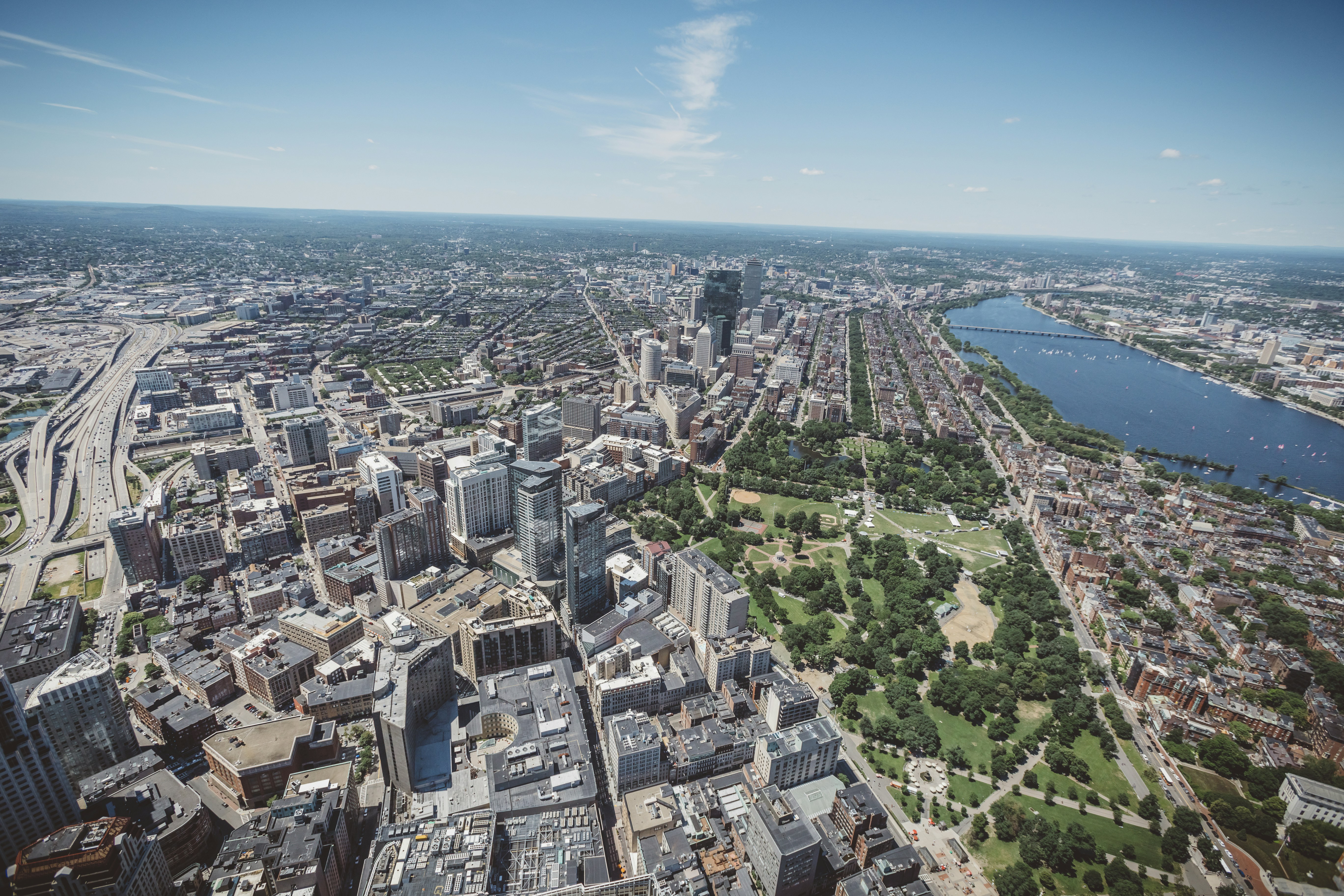 Urban Crown: A Bird’s-Eye Glimpse Over a River-Adorned Skyline