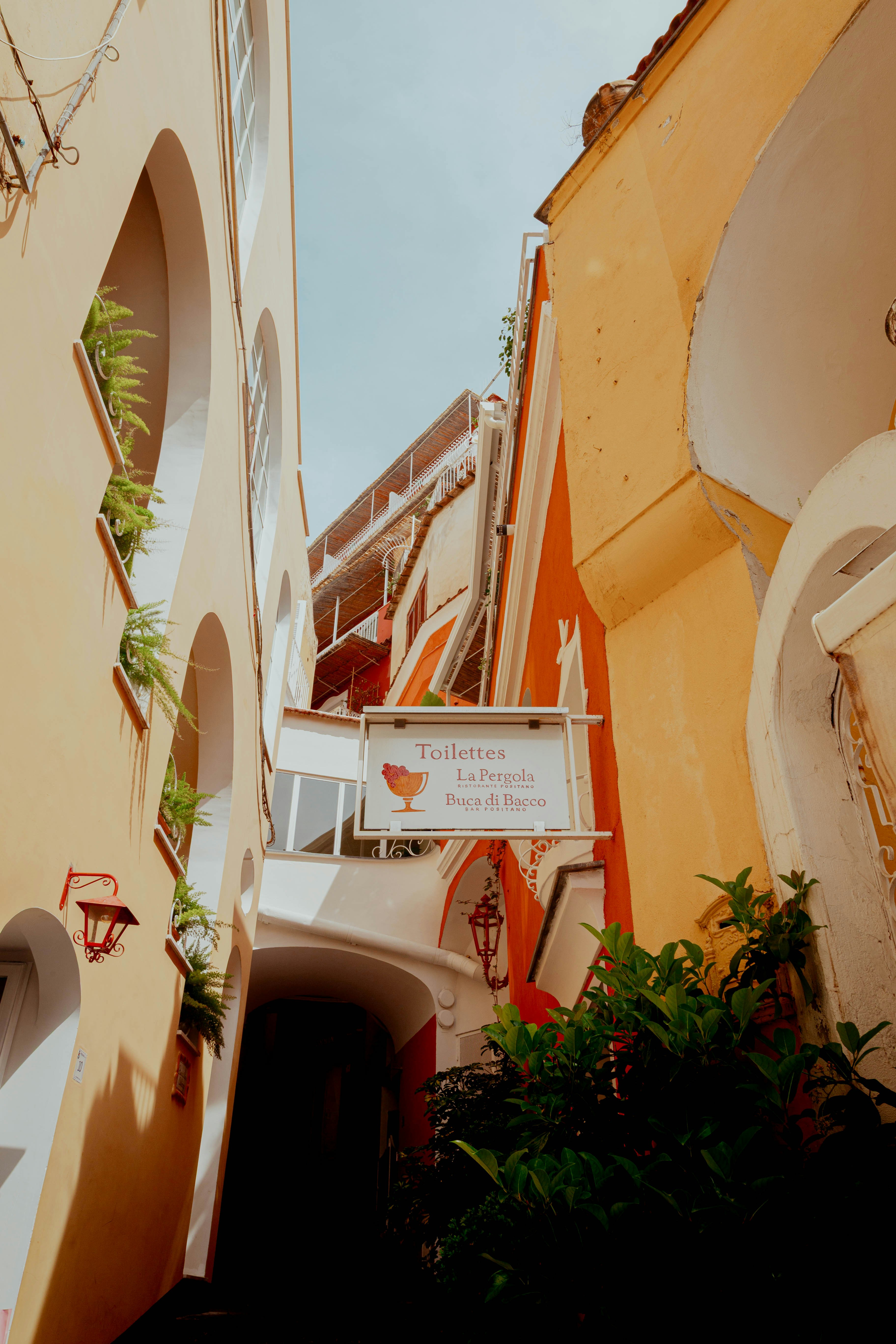 Alleyway Escape: Sunlit Archways and Coastal Tones