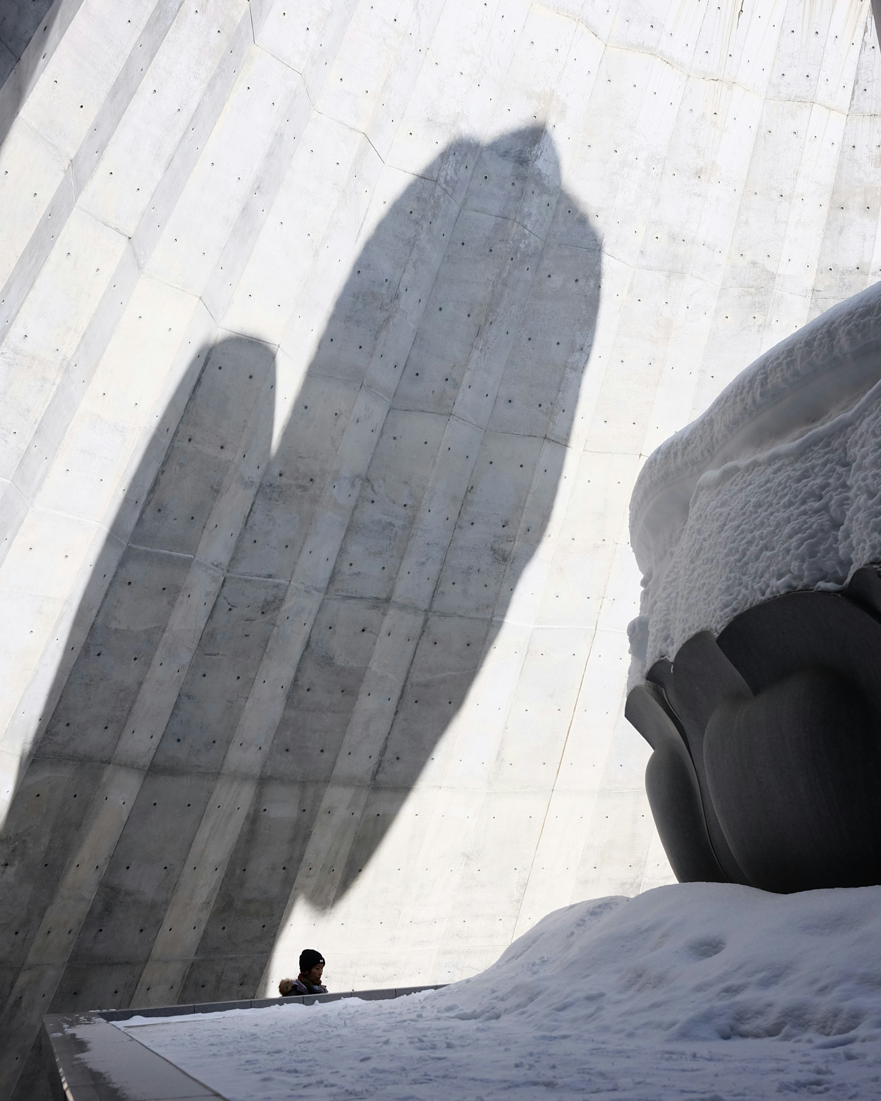 Shadowed Figures on Cold Concrete Steps