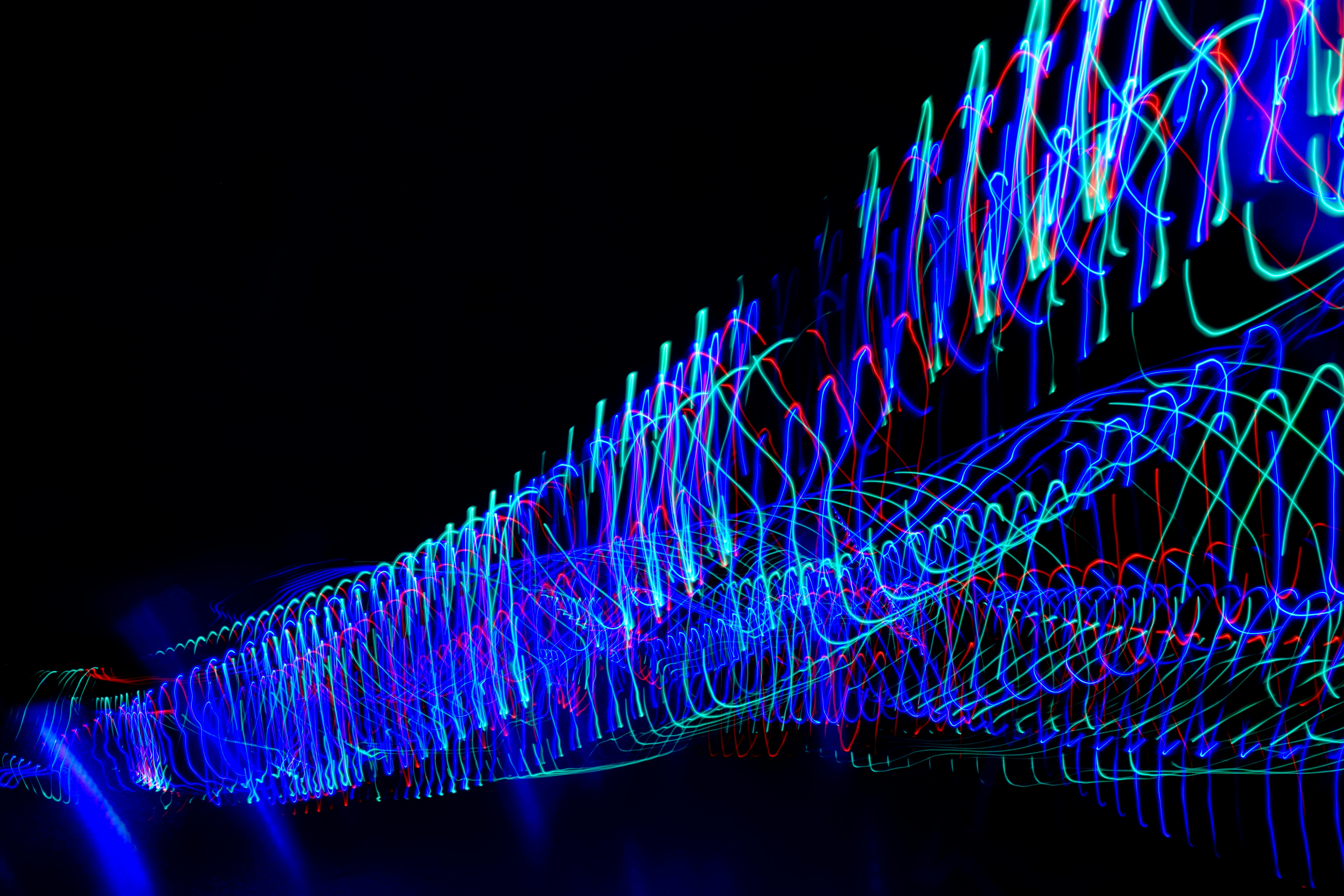 Neon Serpents in the Dark: Long-Exposure Light Trails