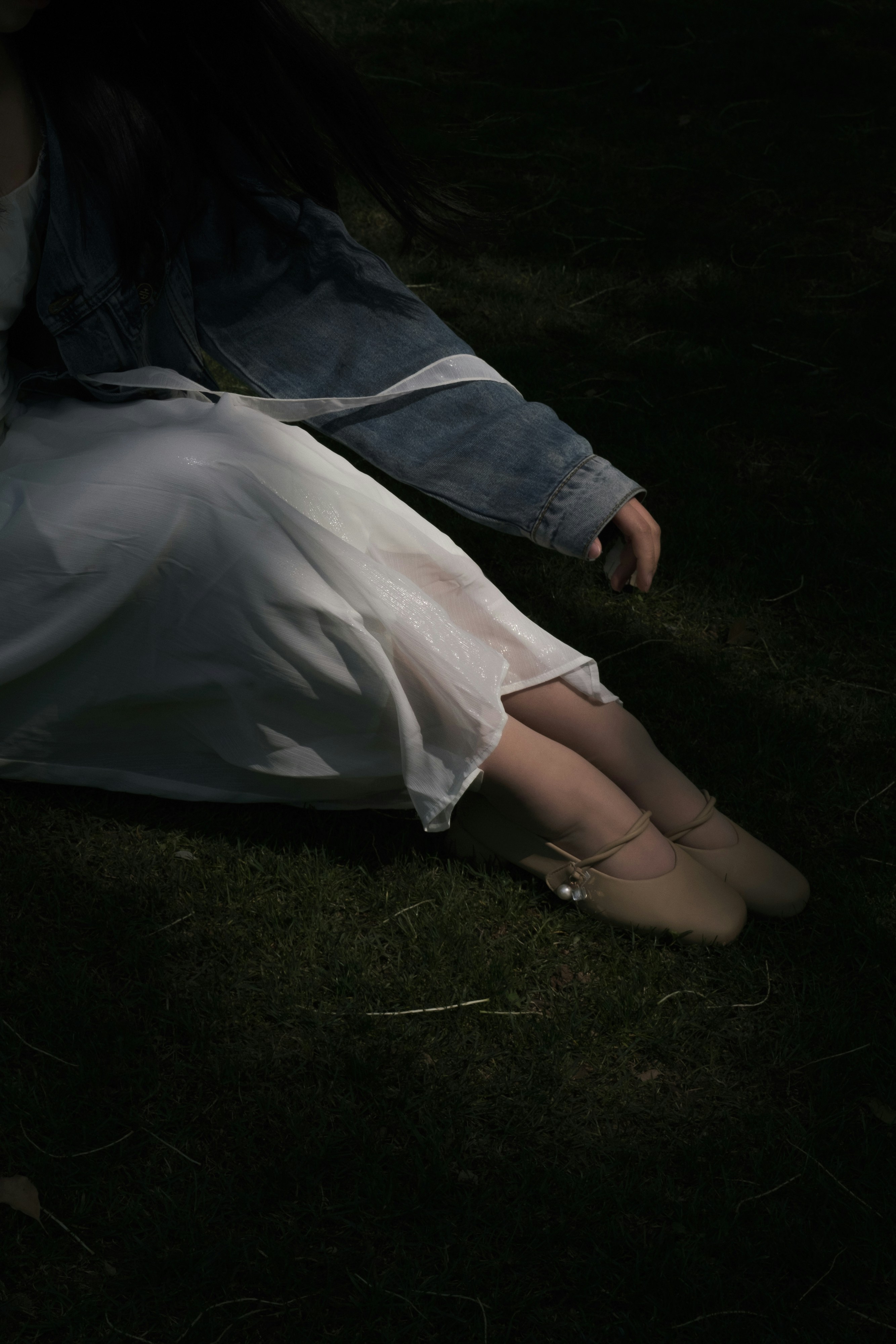 Quiet Reverie: A Laced Moment on Dark Grass