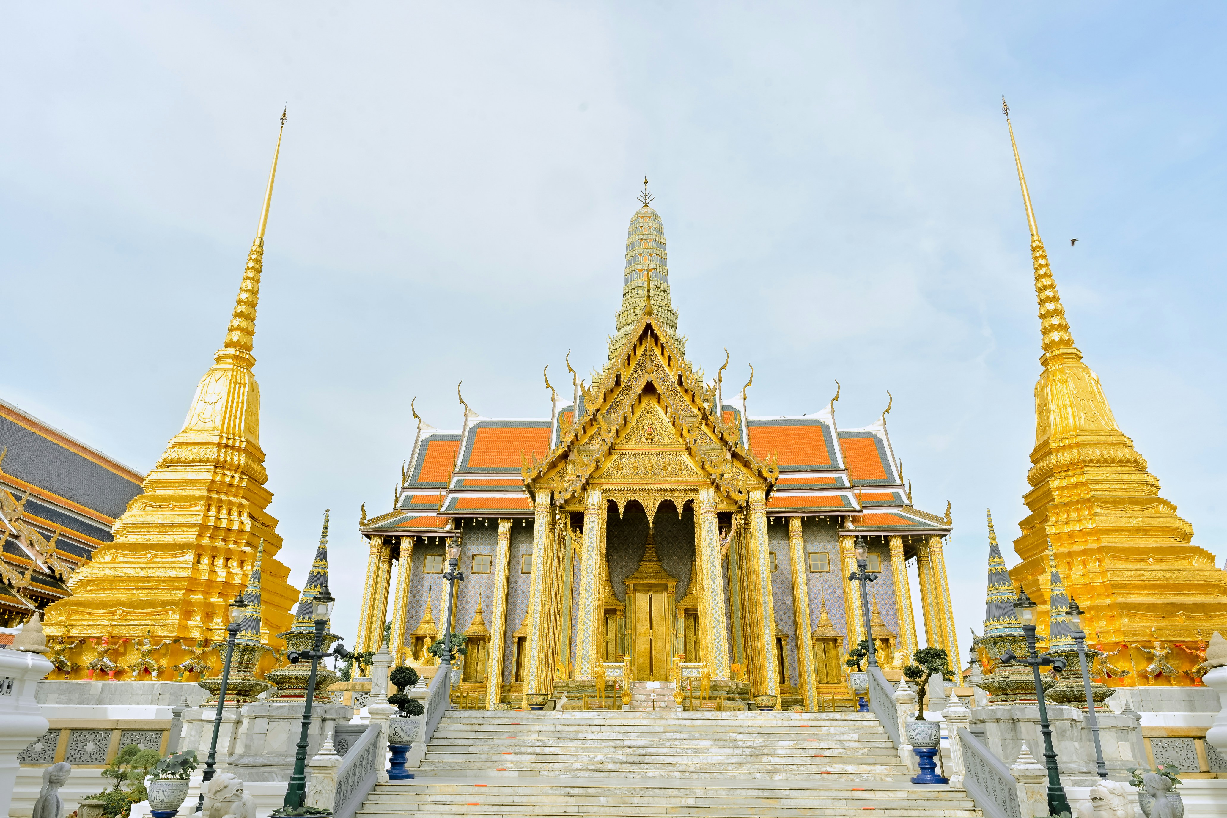 Golden Temple Gate: Symmetry and Spires Rise Over Stairs