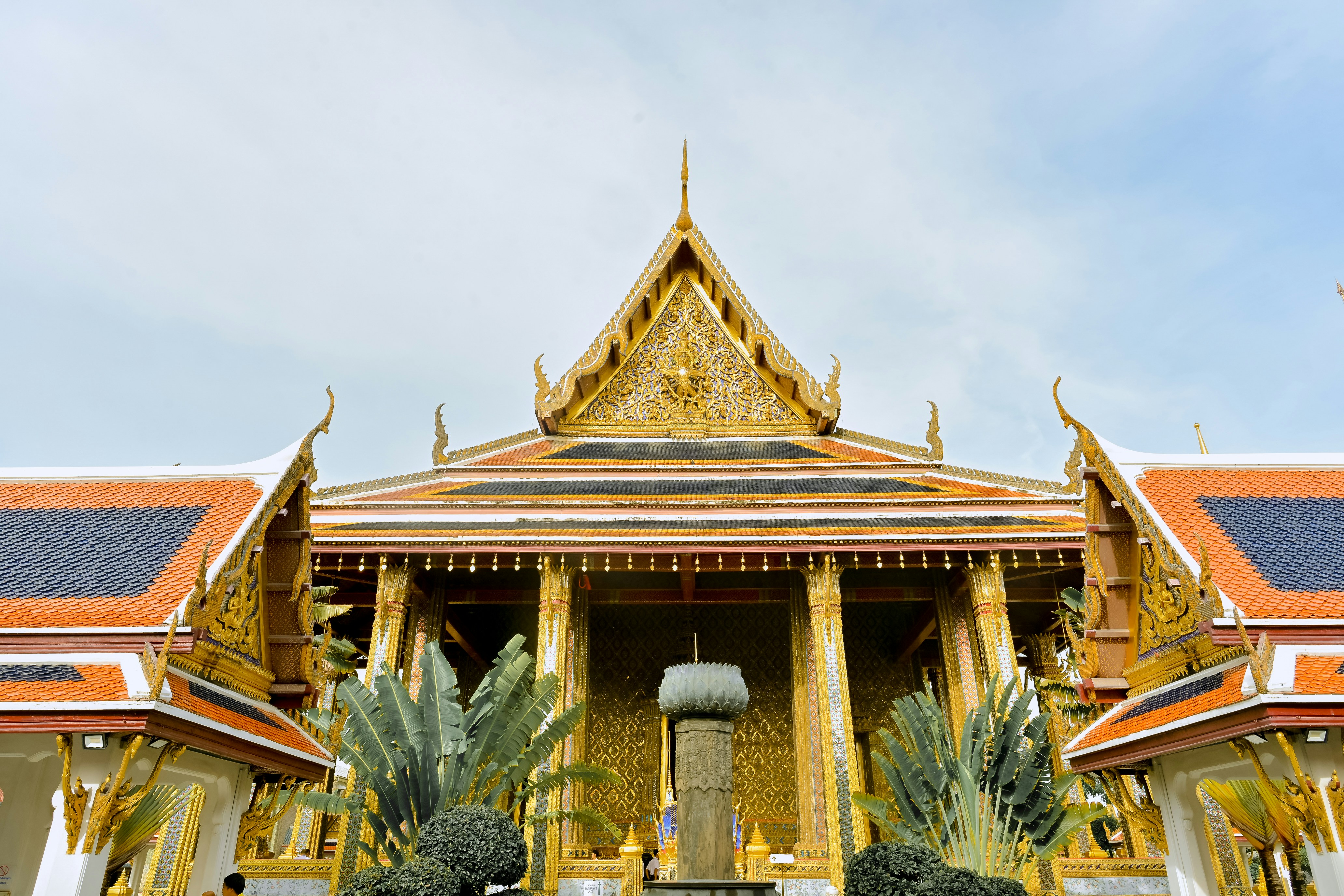 Golden Temple Facade: Intricate Shrine Beneath a Clear Sky