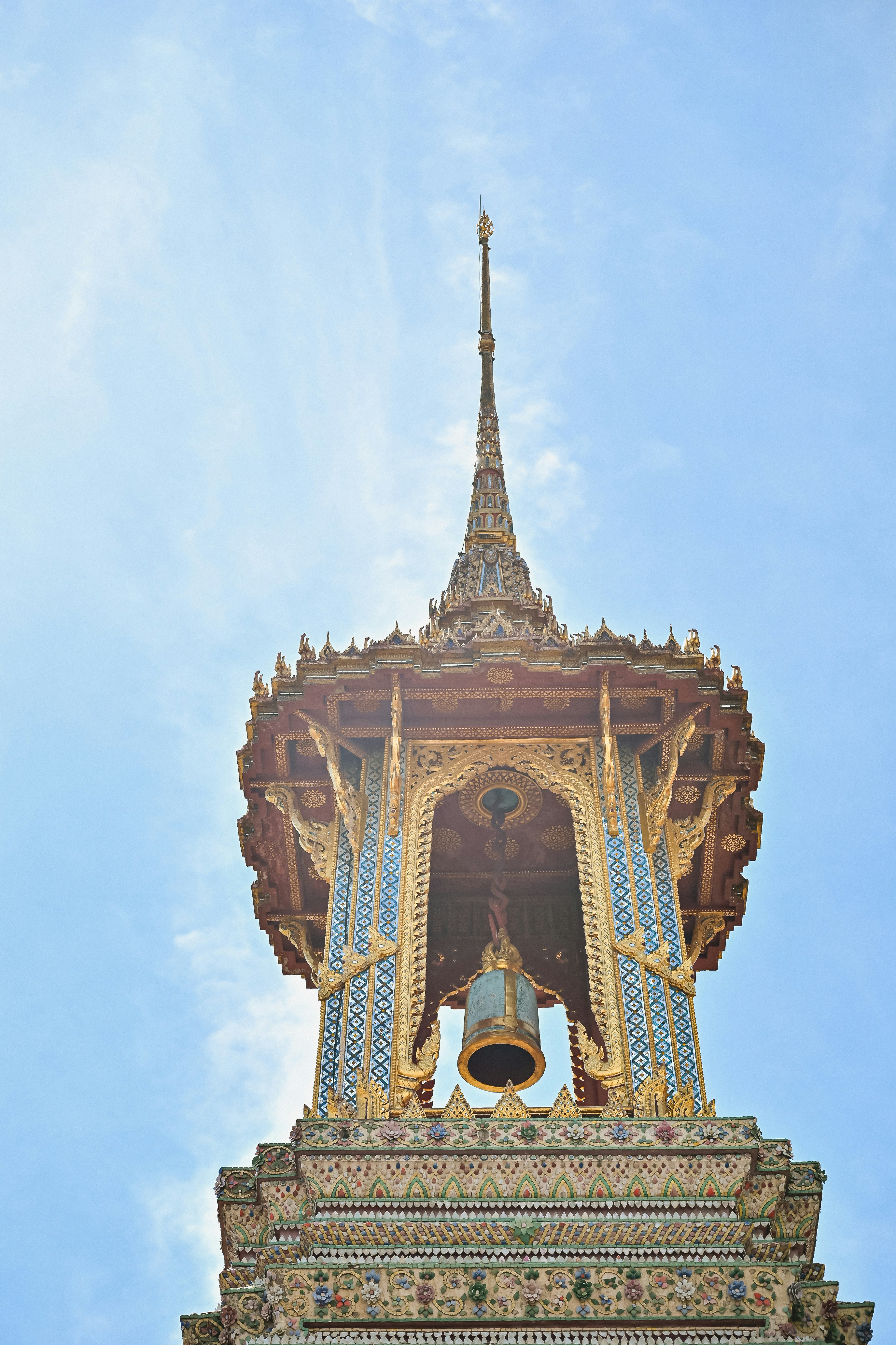 Ornate Spire Soaring Above Temple Roof