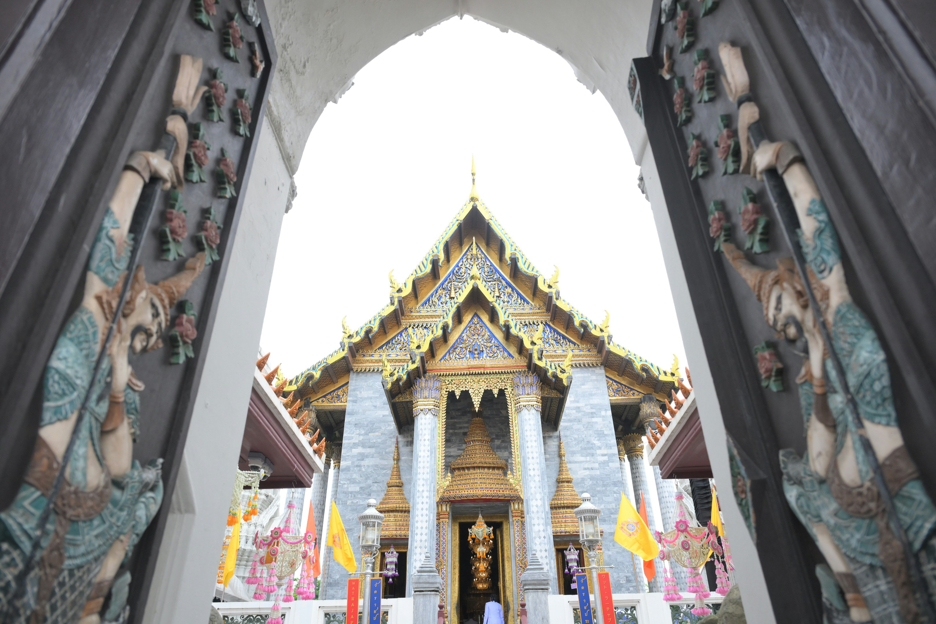 Gateway to the Golden Roof: Framed Temple Entrance