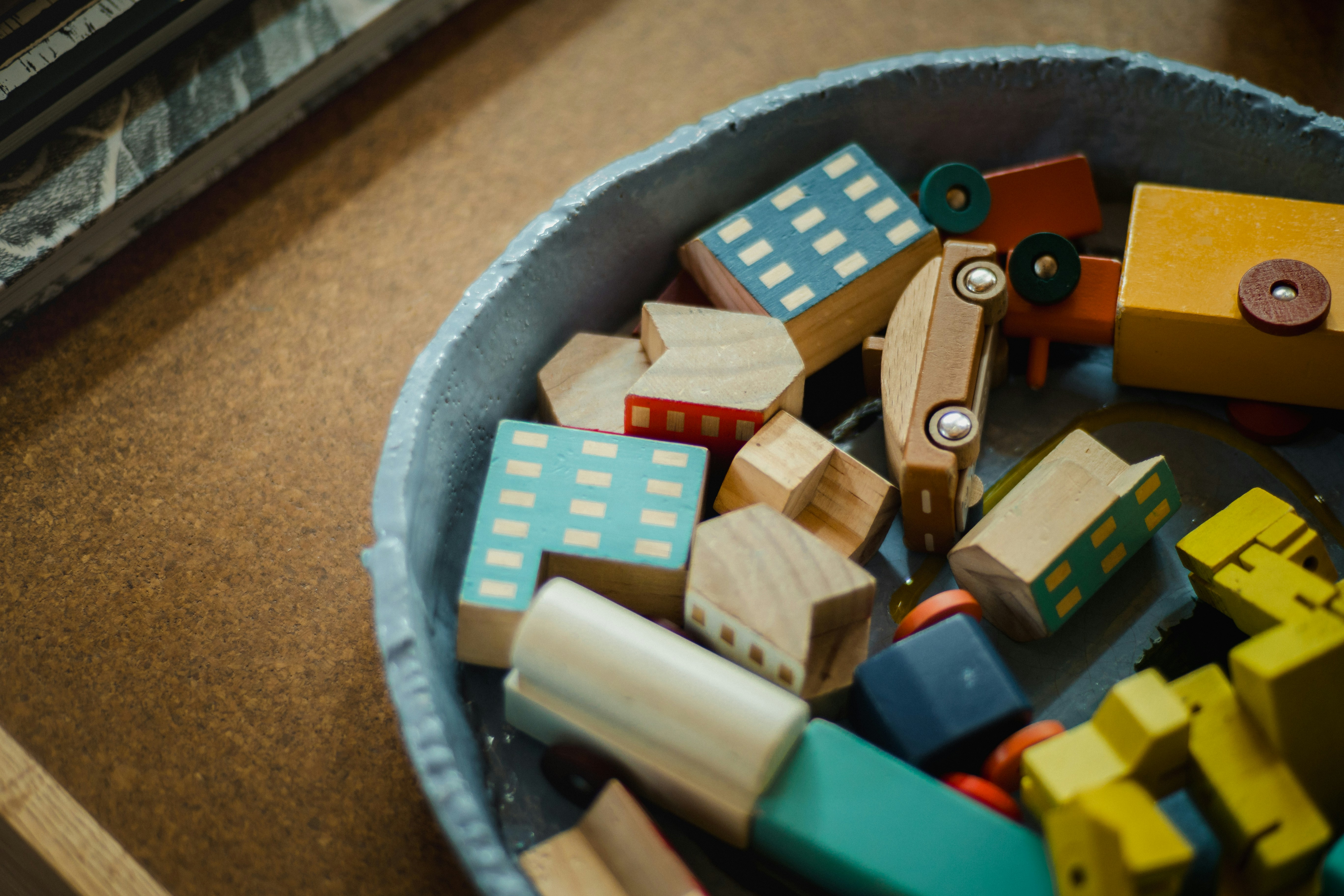 Colorful wooden cityscape in a blue bowl