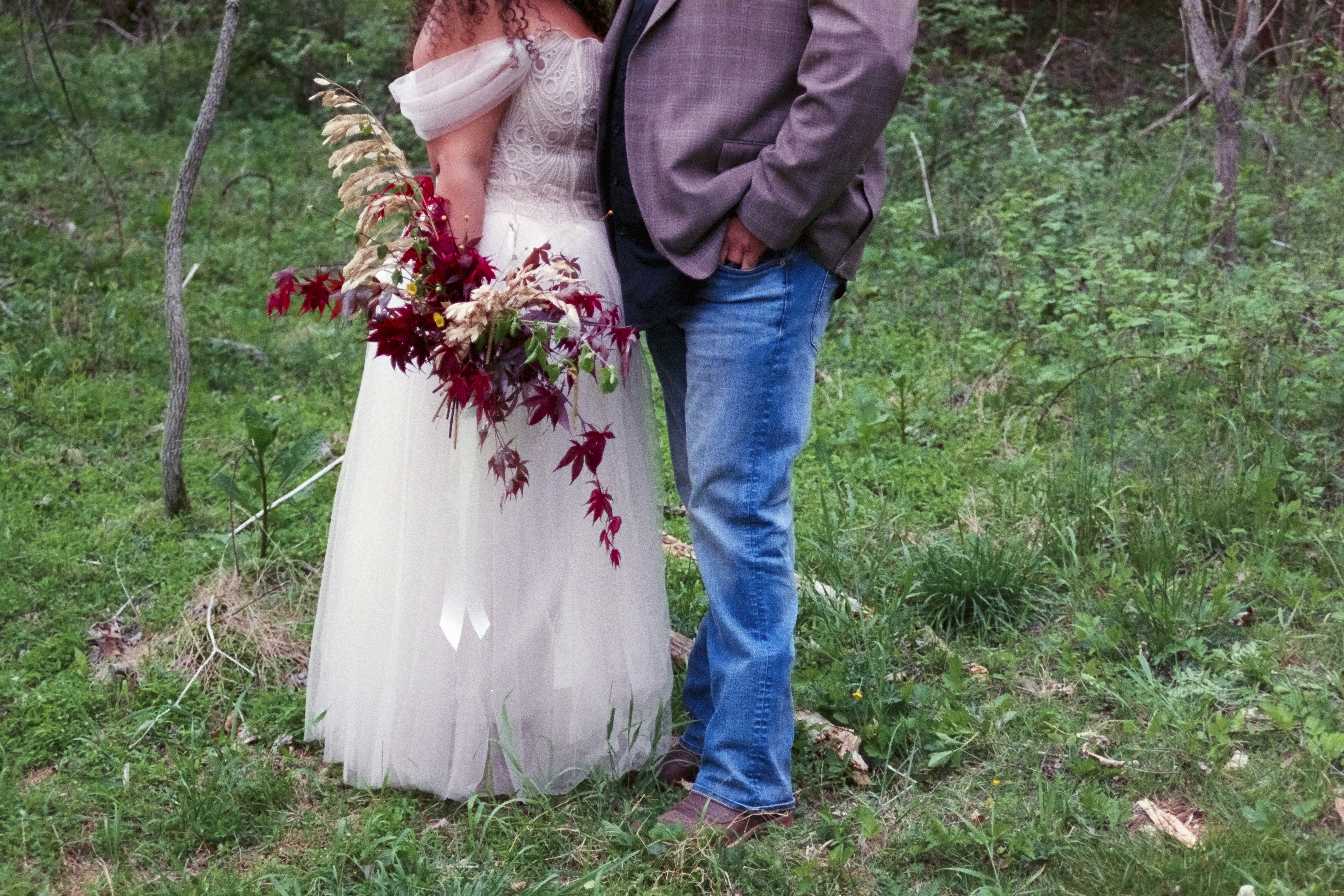Bride and Groom in the Meadow: A Quiet Moment Between Vows