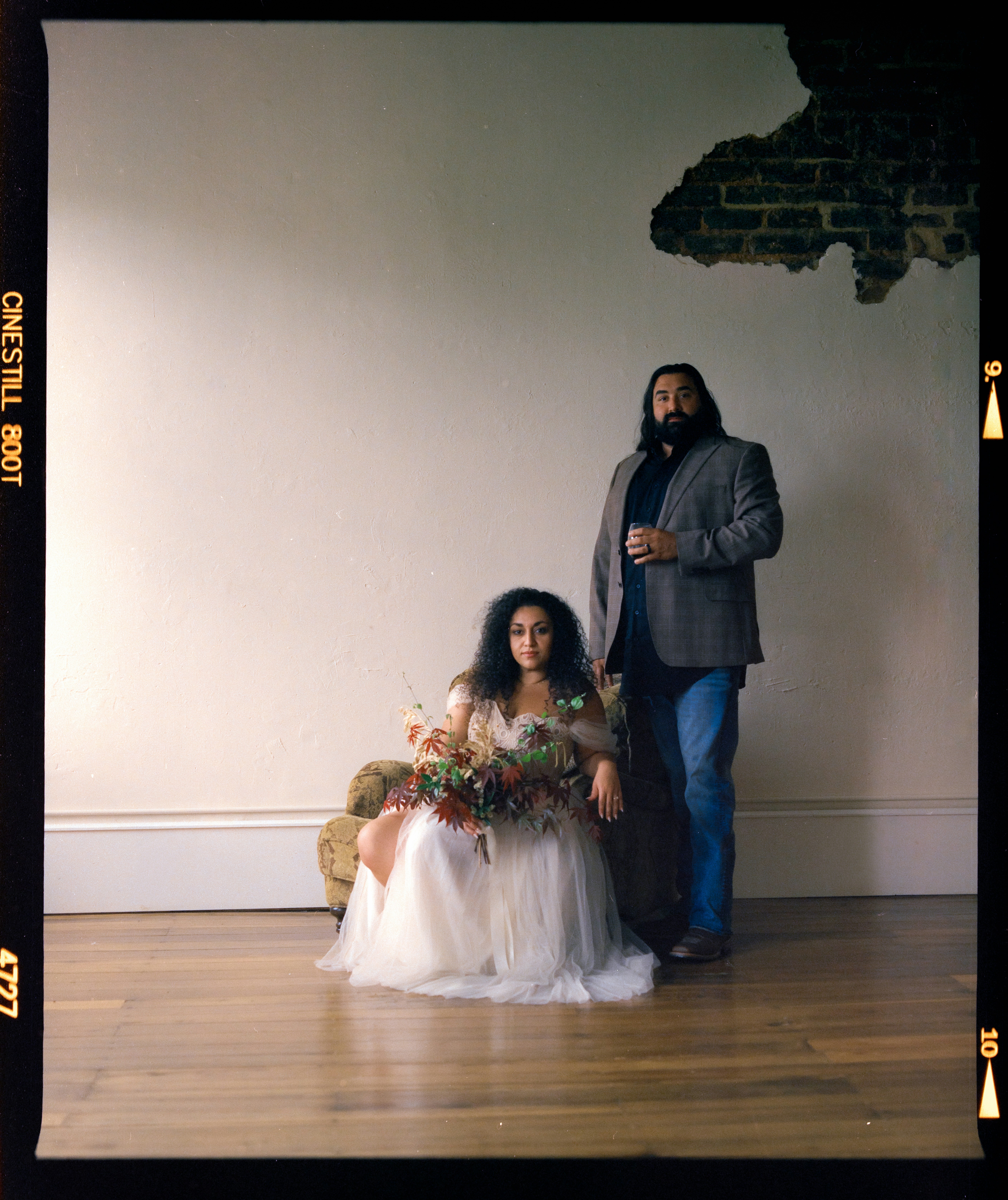Bride and Groom Emergence: A Quiet Hallway Portrait
