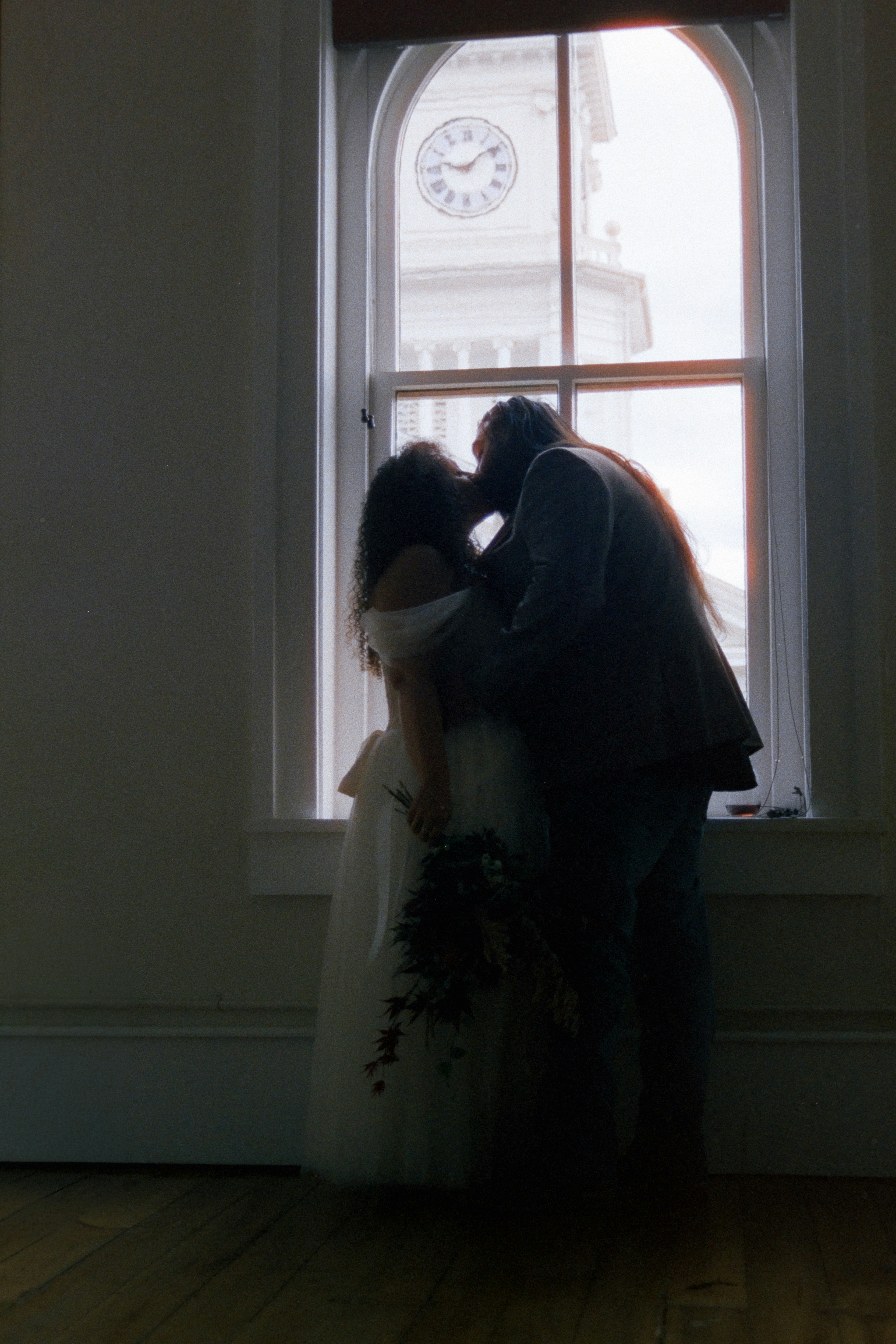 Kiss by the Window: A Quiet Moment in Time