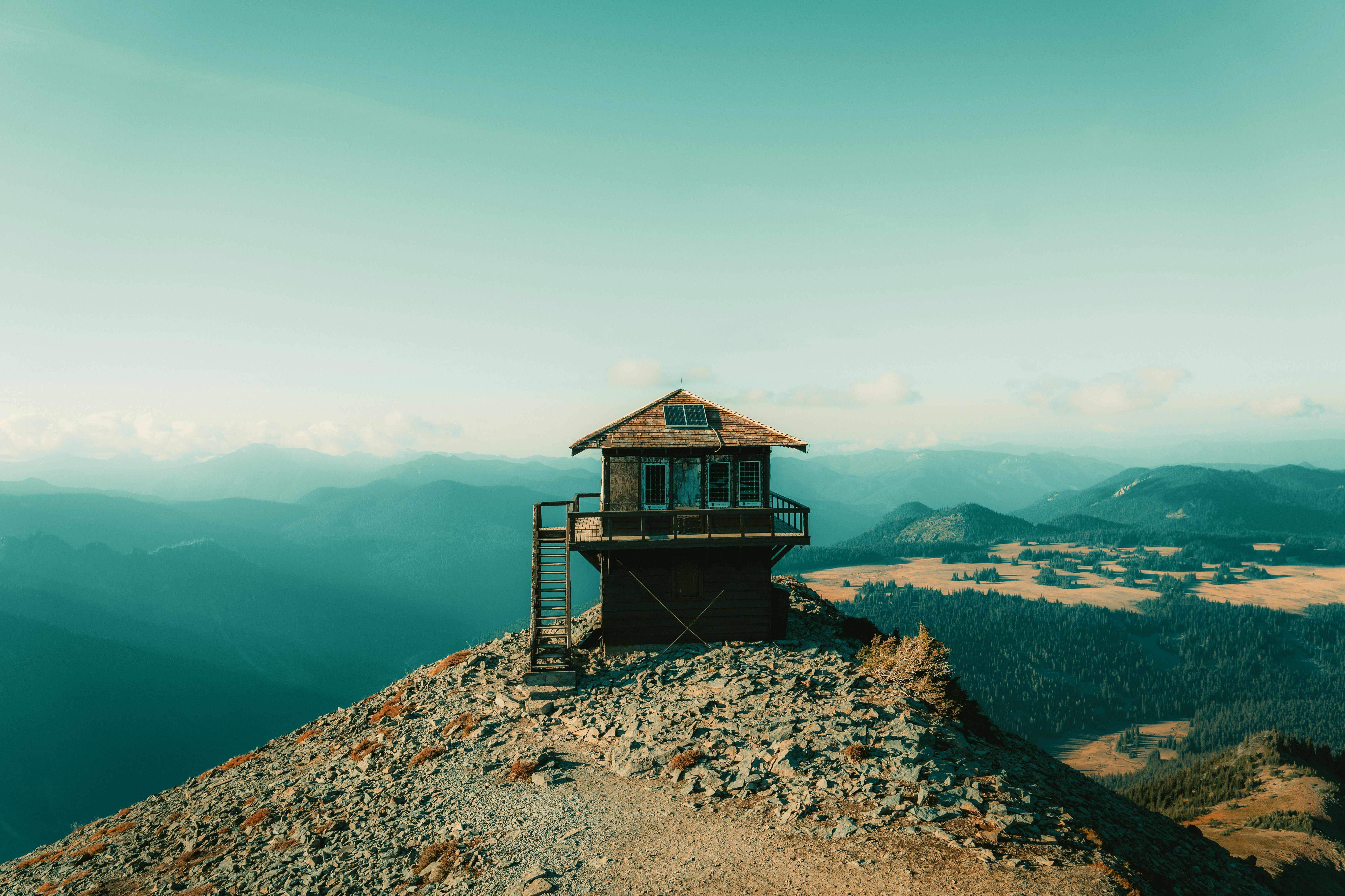 High-Ridge Lookout: A lone cabin perched over vast alpine slopes