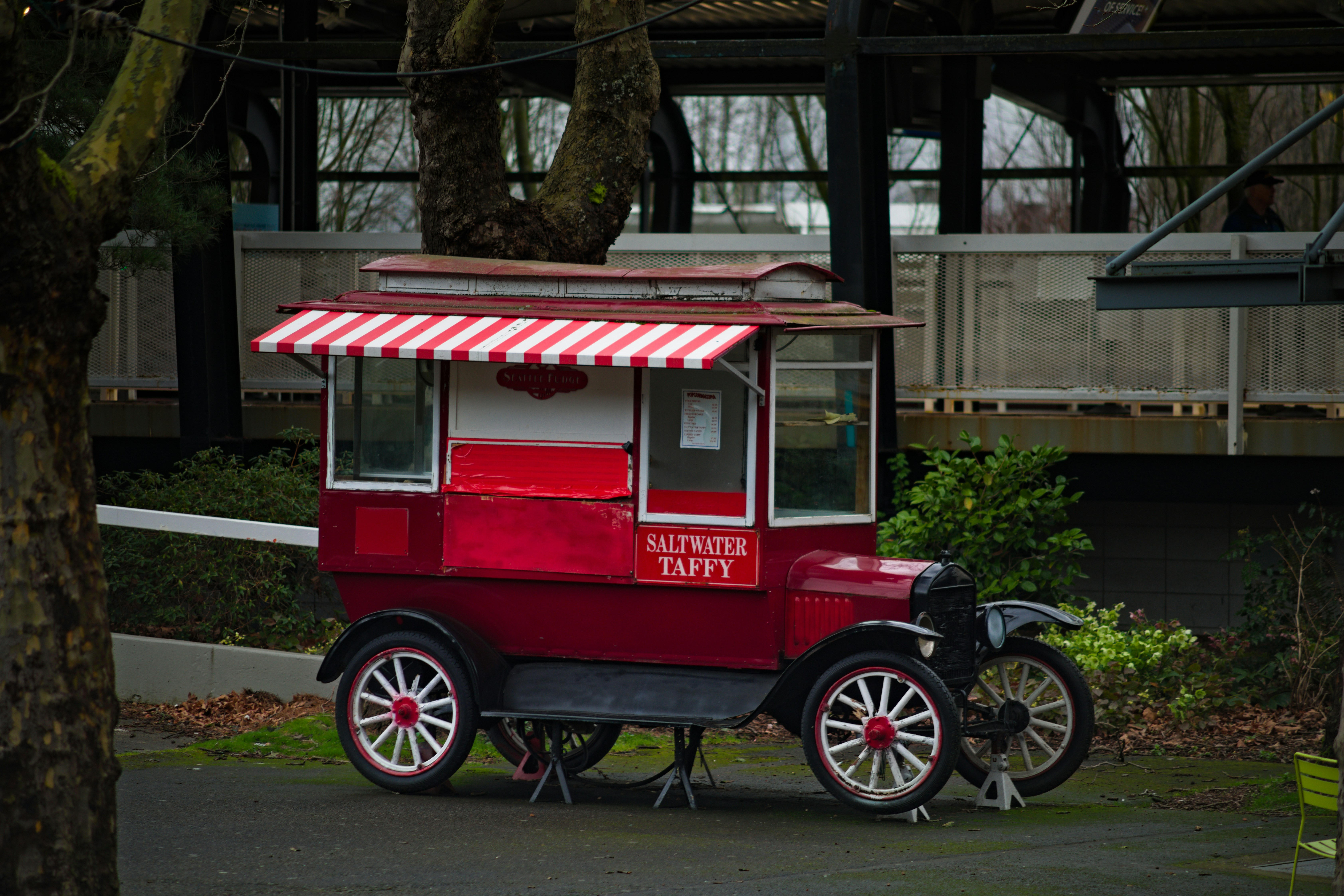 Red Street Cart Under a Canopy: A Nostalgic Food Stand in Quiet Park