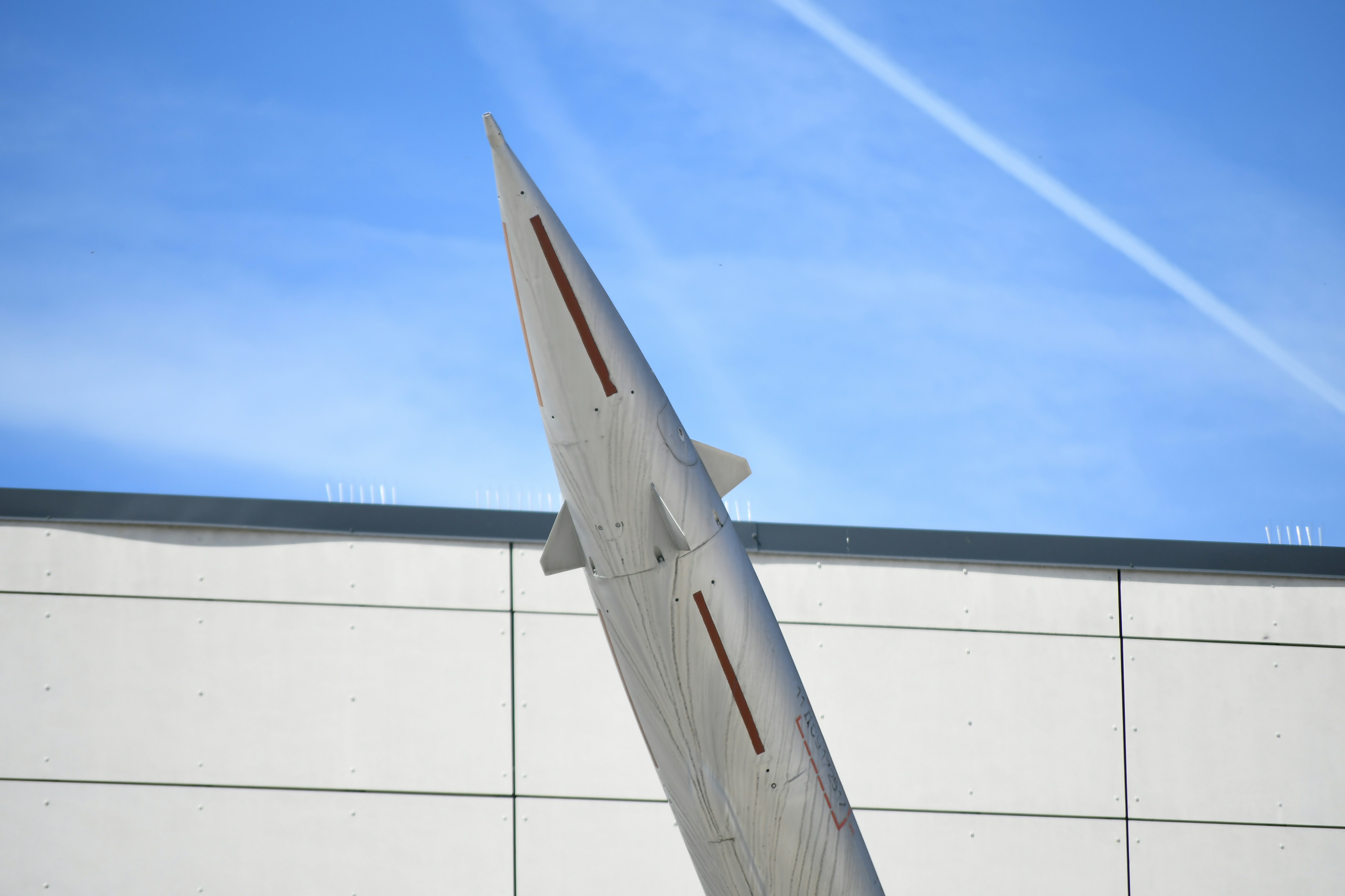 Angular Wing Silhouette Against a Bright Sydney Sky