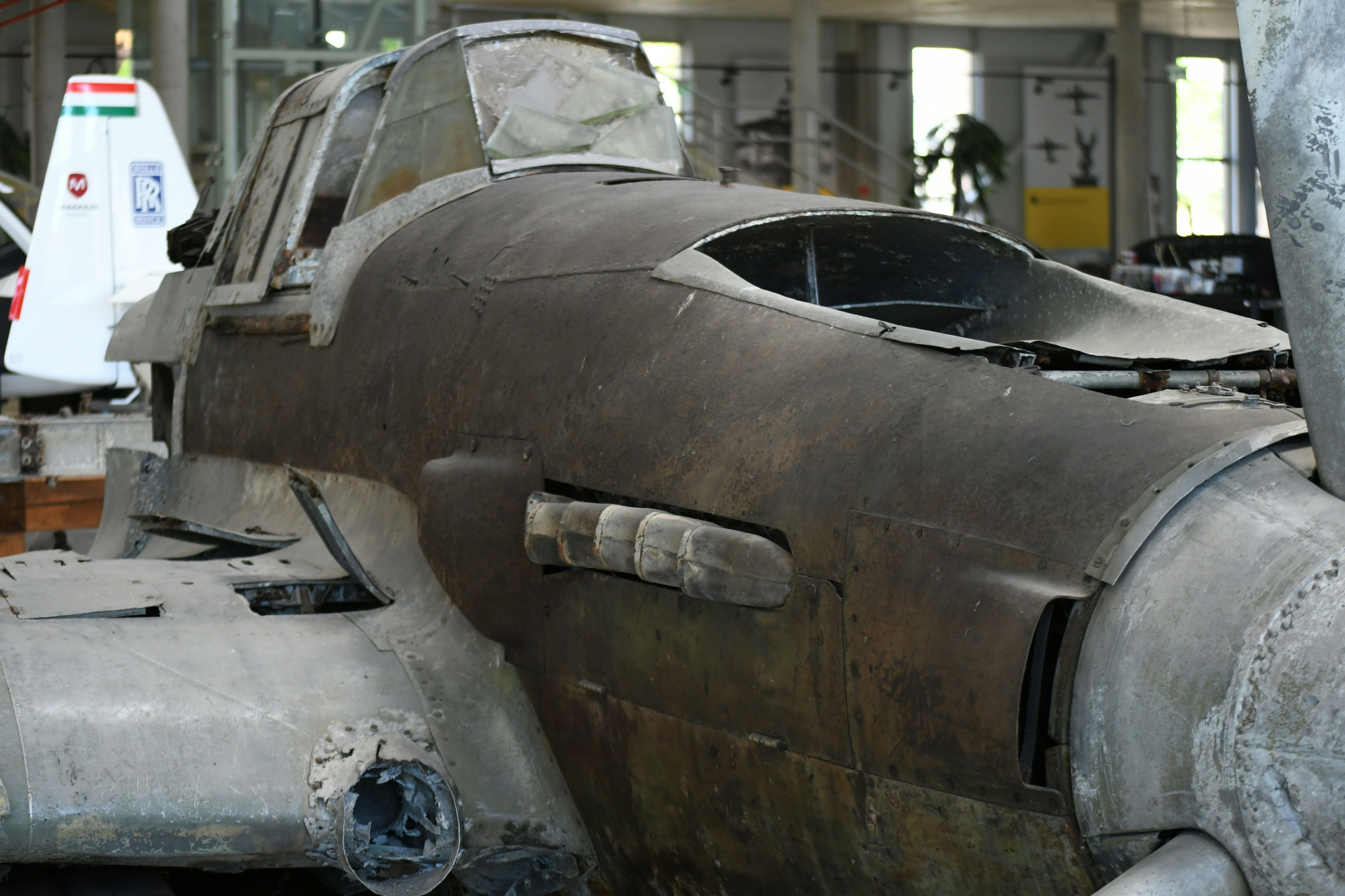 Rust and Remnants: The Nose of a WWII Barrel Nose in a Quiet Museum Hangar
