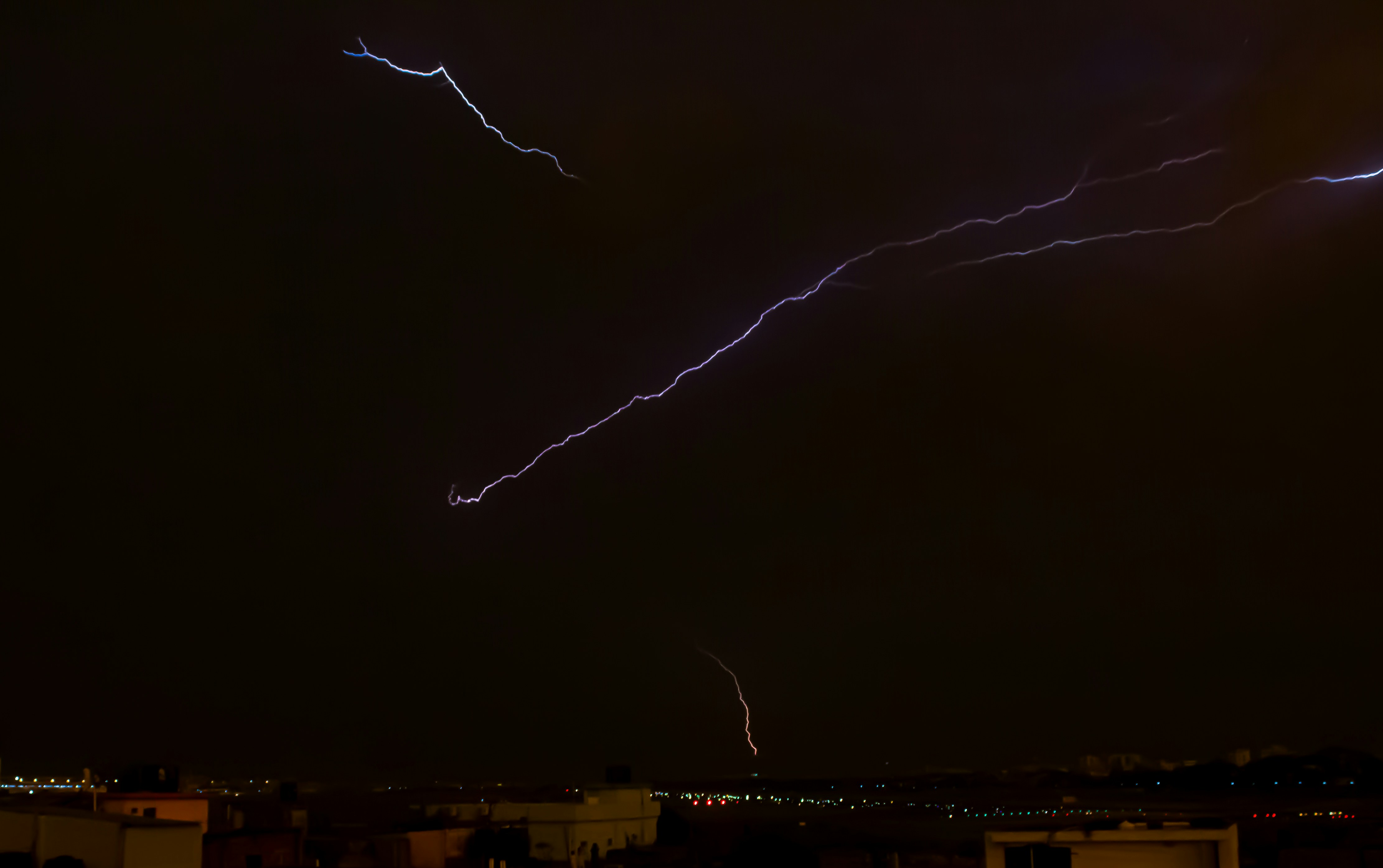 Lightning Skies Over a Quiet City at Night