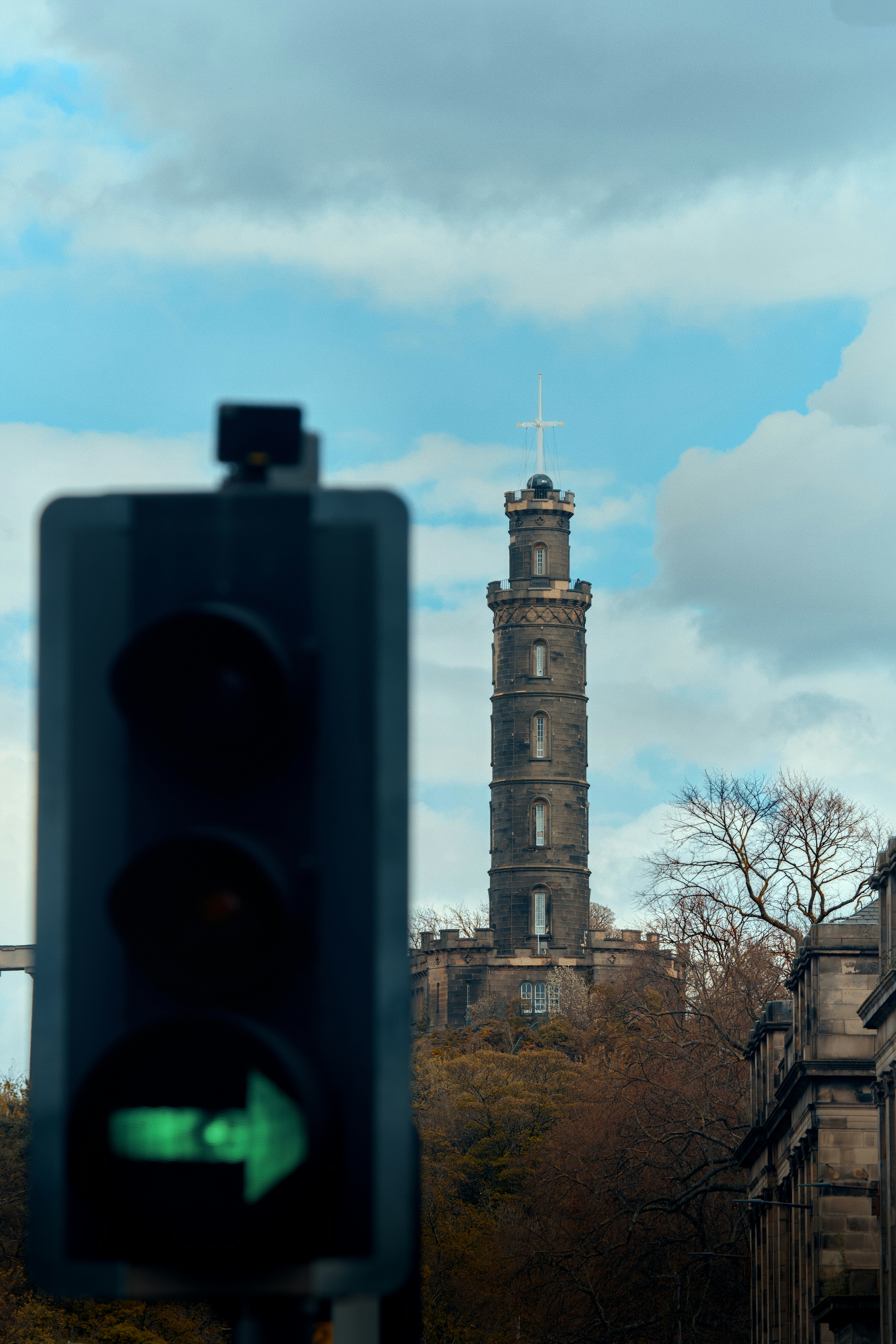 Traffic Light in the Shadow of a Clocktower