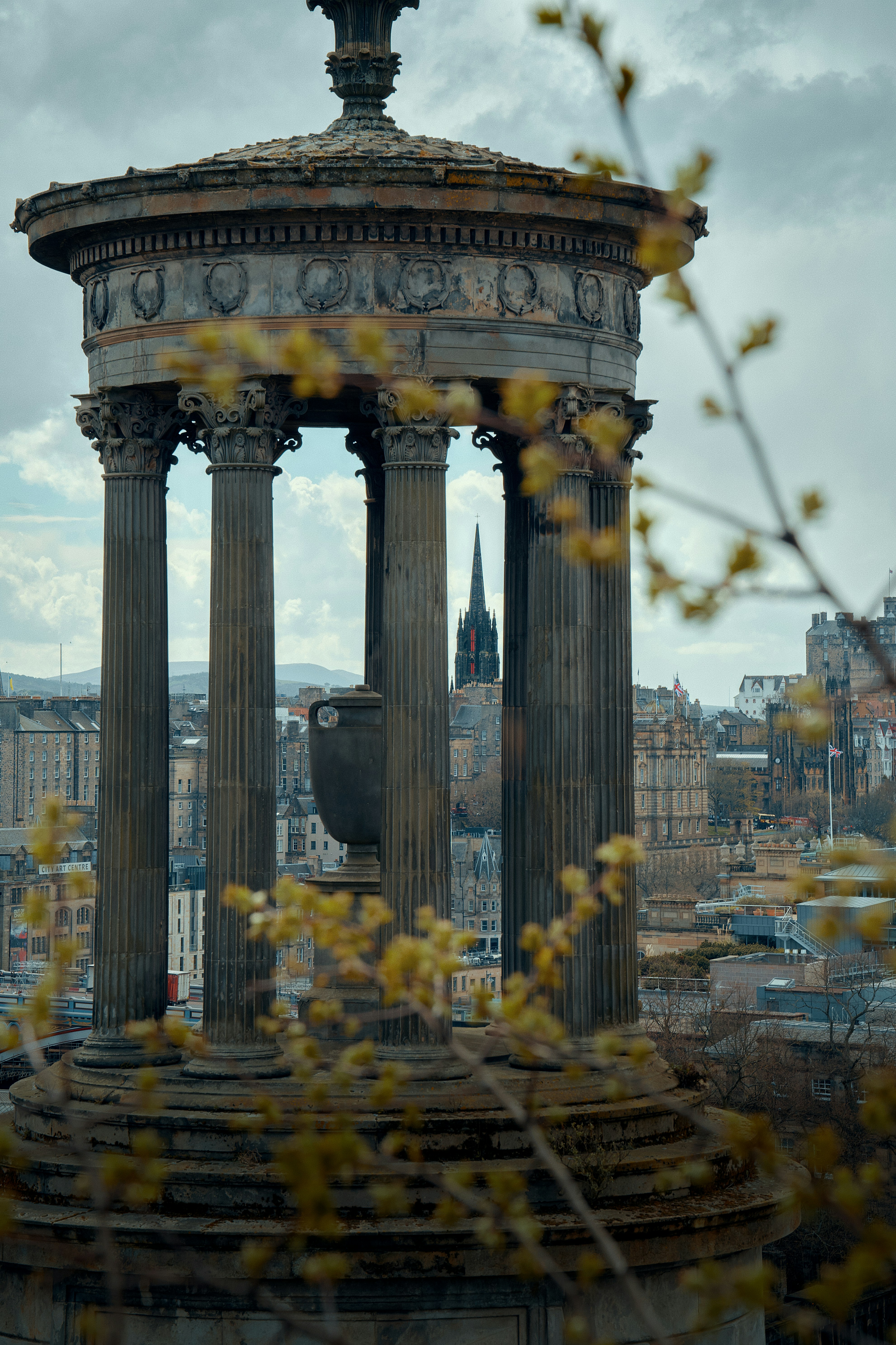Circular Temple Framed by City Steeples: A Climb Toward the Skyline