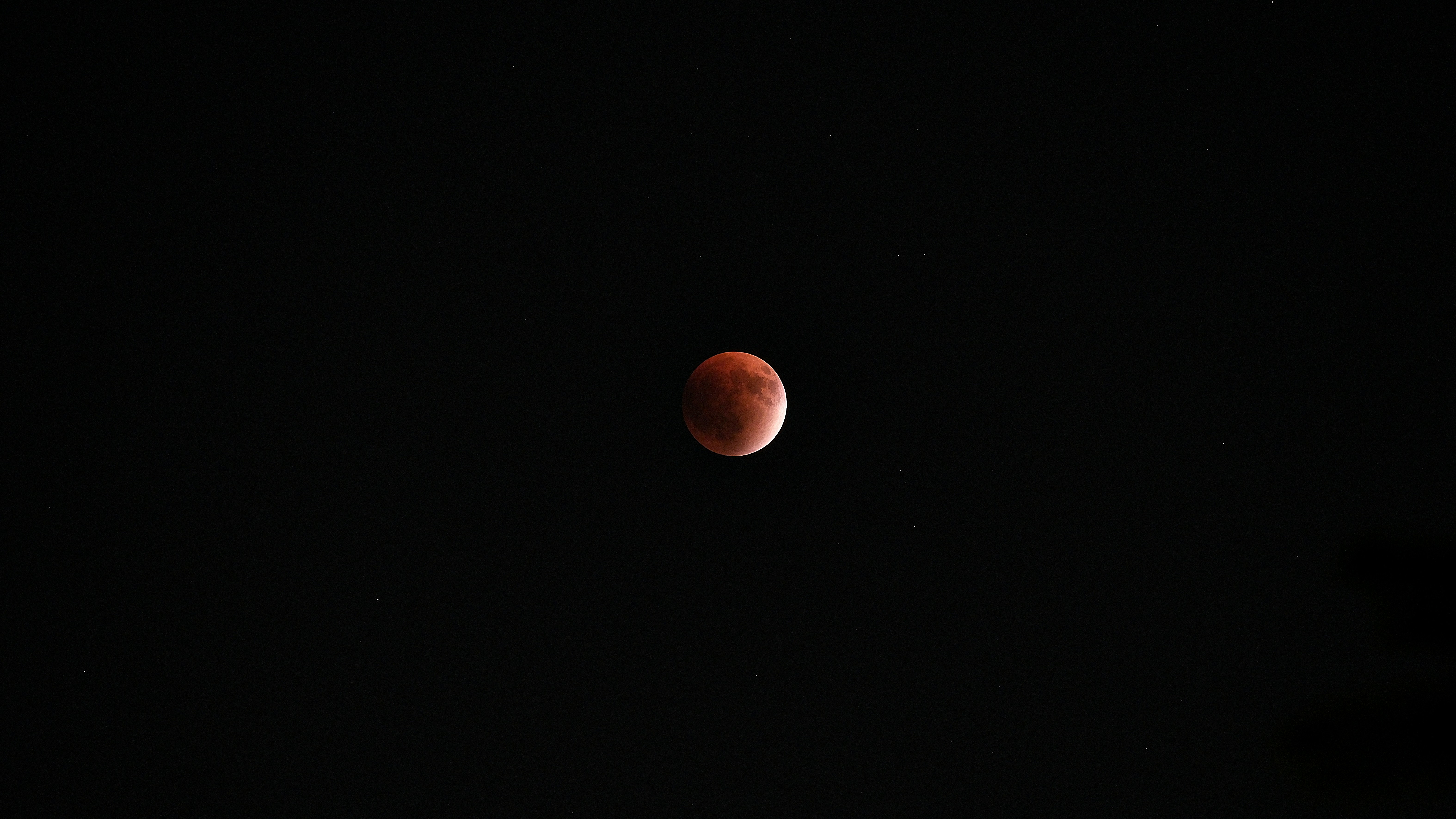 Crimson Eclipse: A Lunar Pale in a Velvet Night