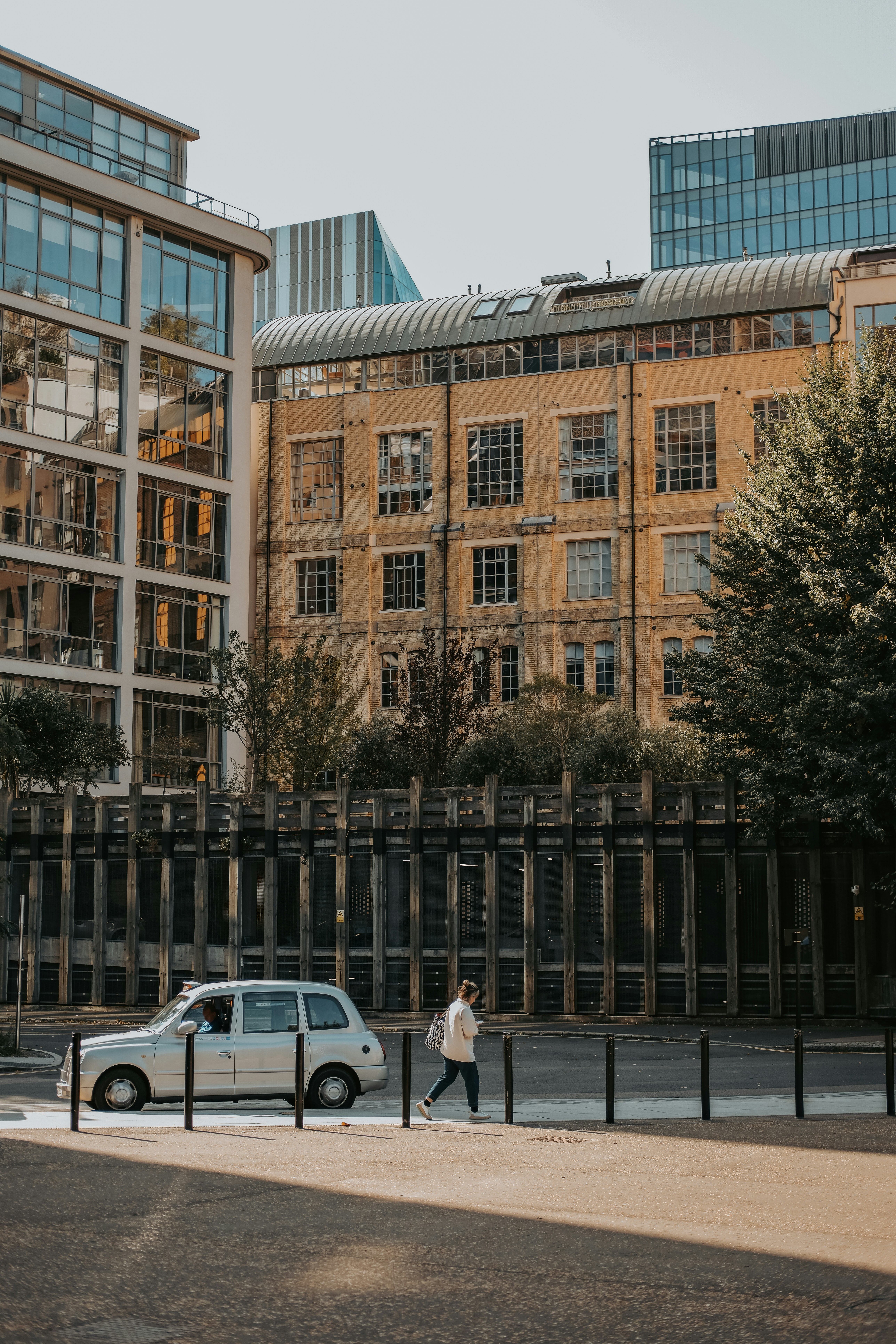 Urban Quiet: A Pedestrian Passes the Edge of Industry