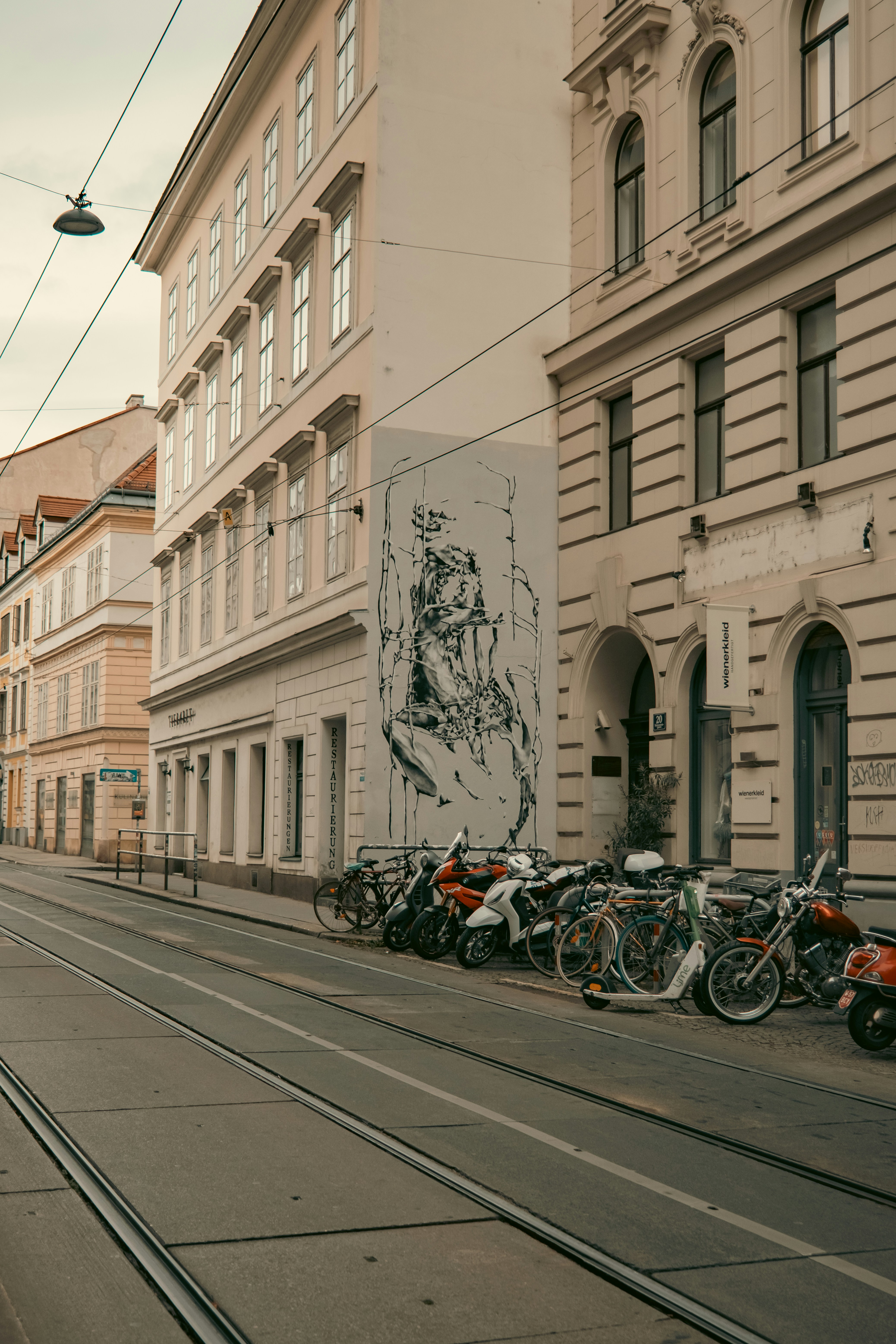 Urban Mirage: A Row of Bikes Under a Historic Facade