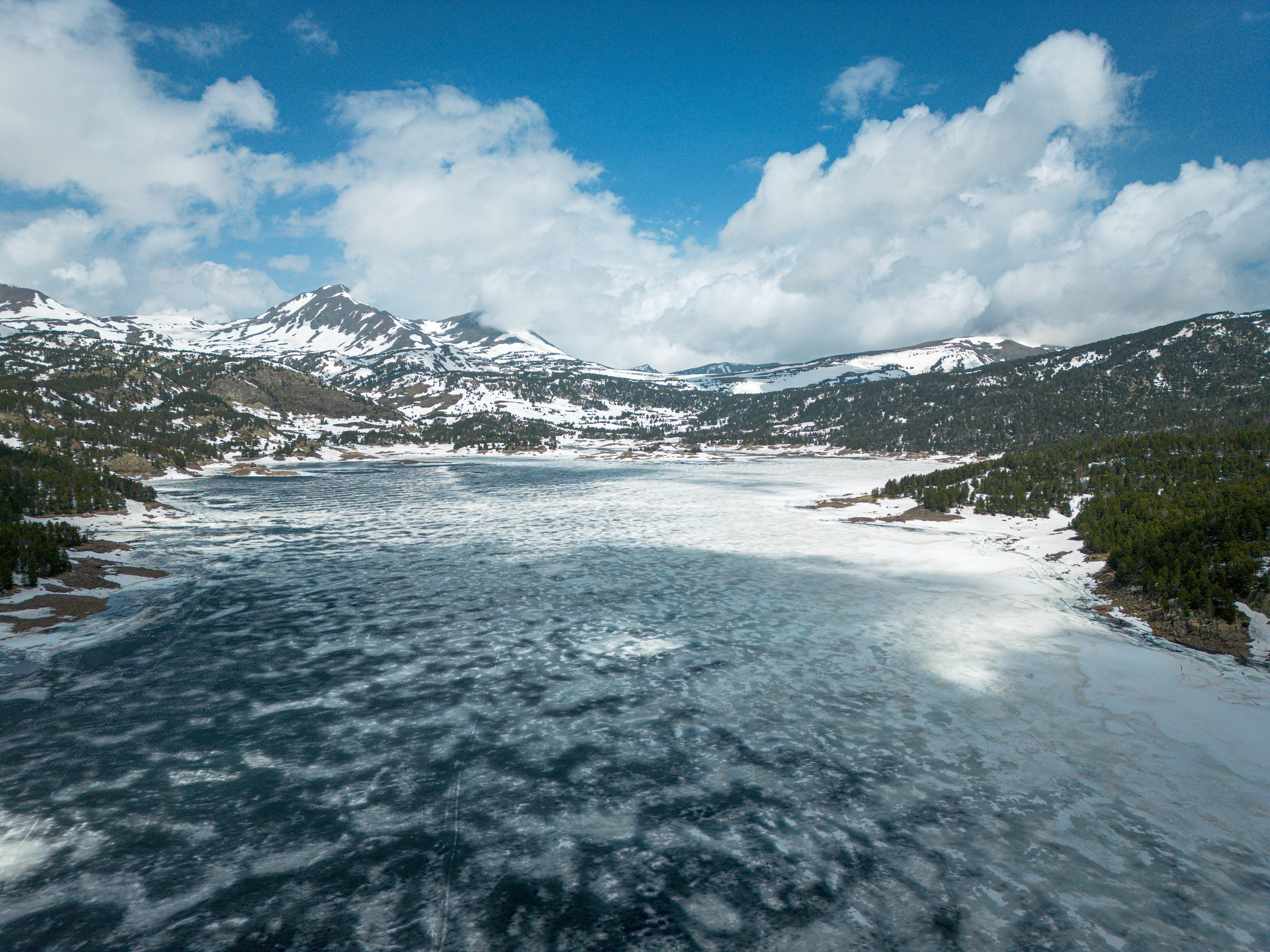 Glacial River Serpent: A Snowfield Rift Under Bright Skies