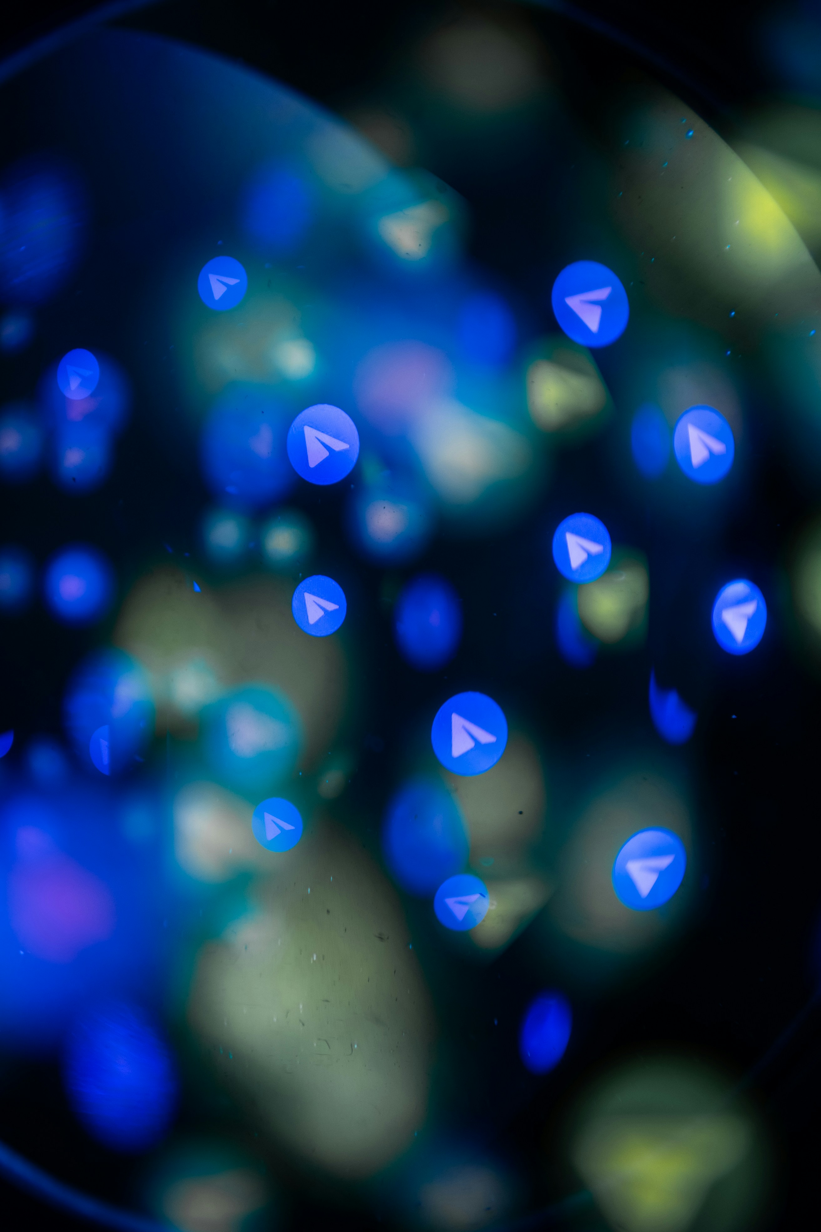 Blue Sensor Bloom: Neon Arrows in a Lens of Orbs