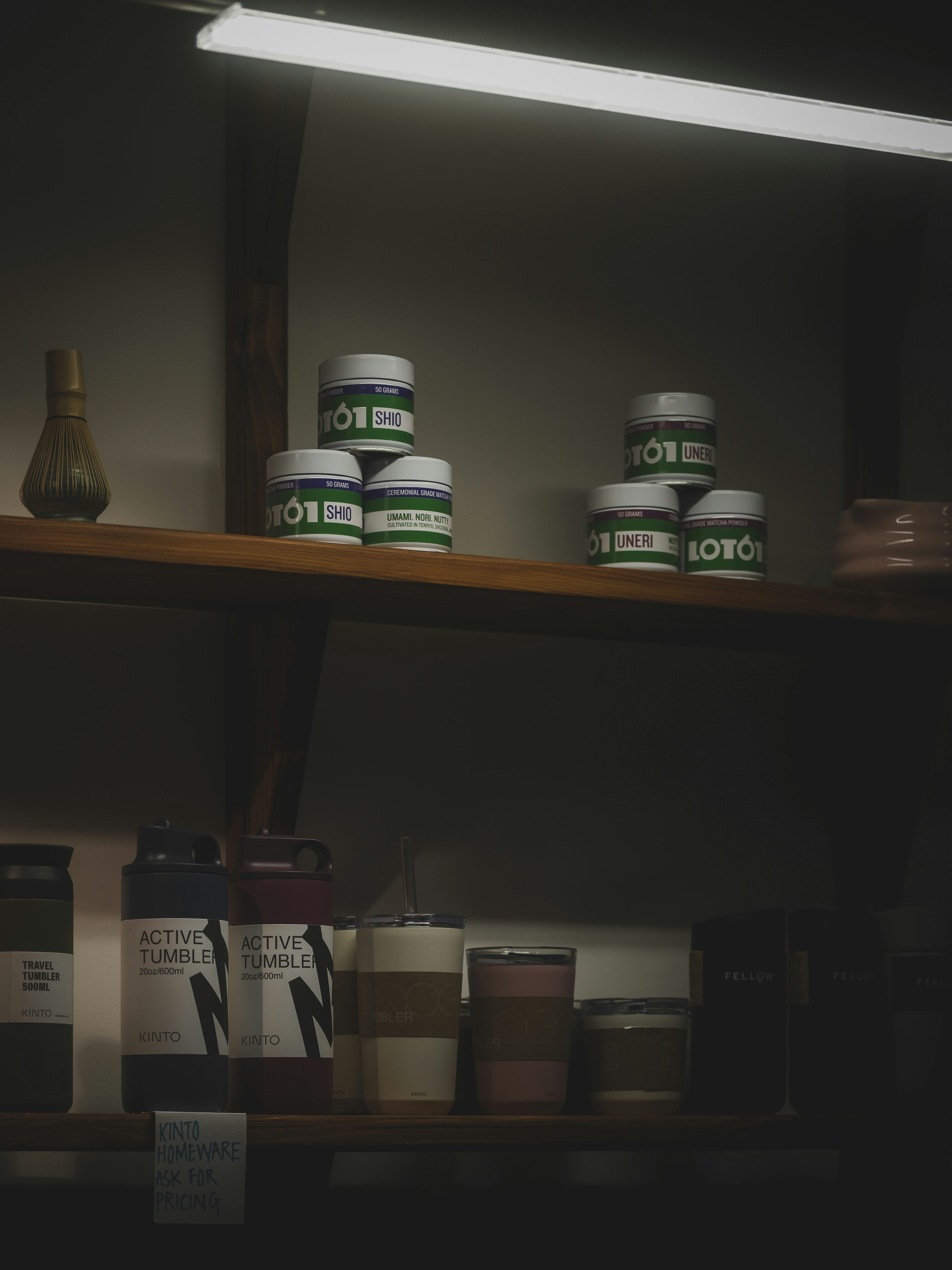 Shelf of Shirotsuyu and Tumbler Bottles in Dim Shop Lighting