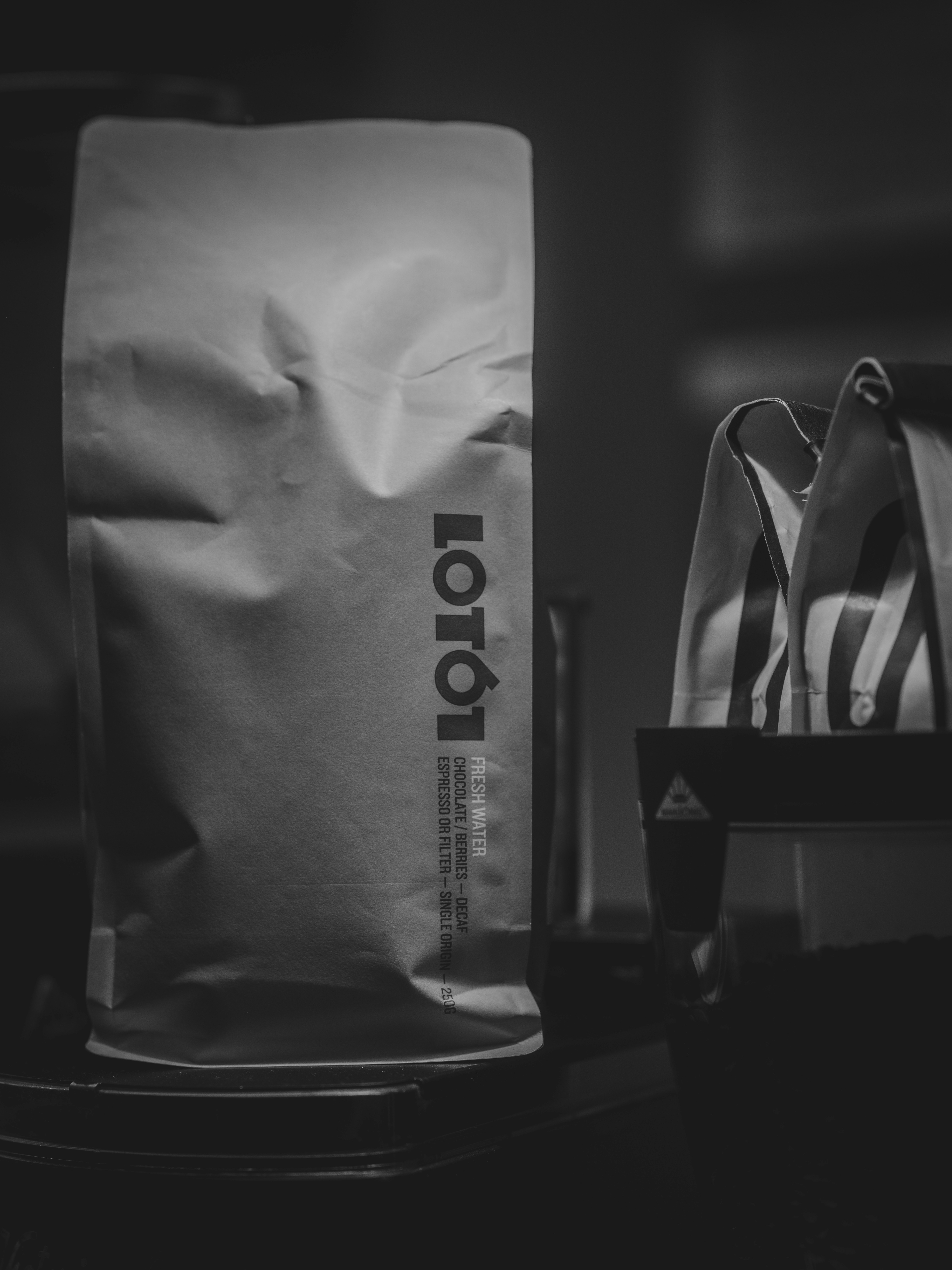 Monochrome Morning: A bag of coffee on a quiet counter