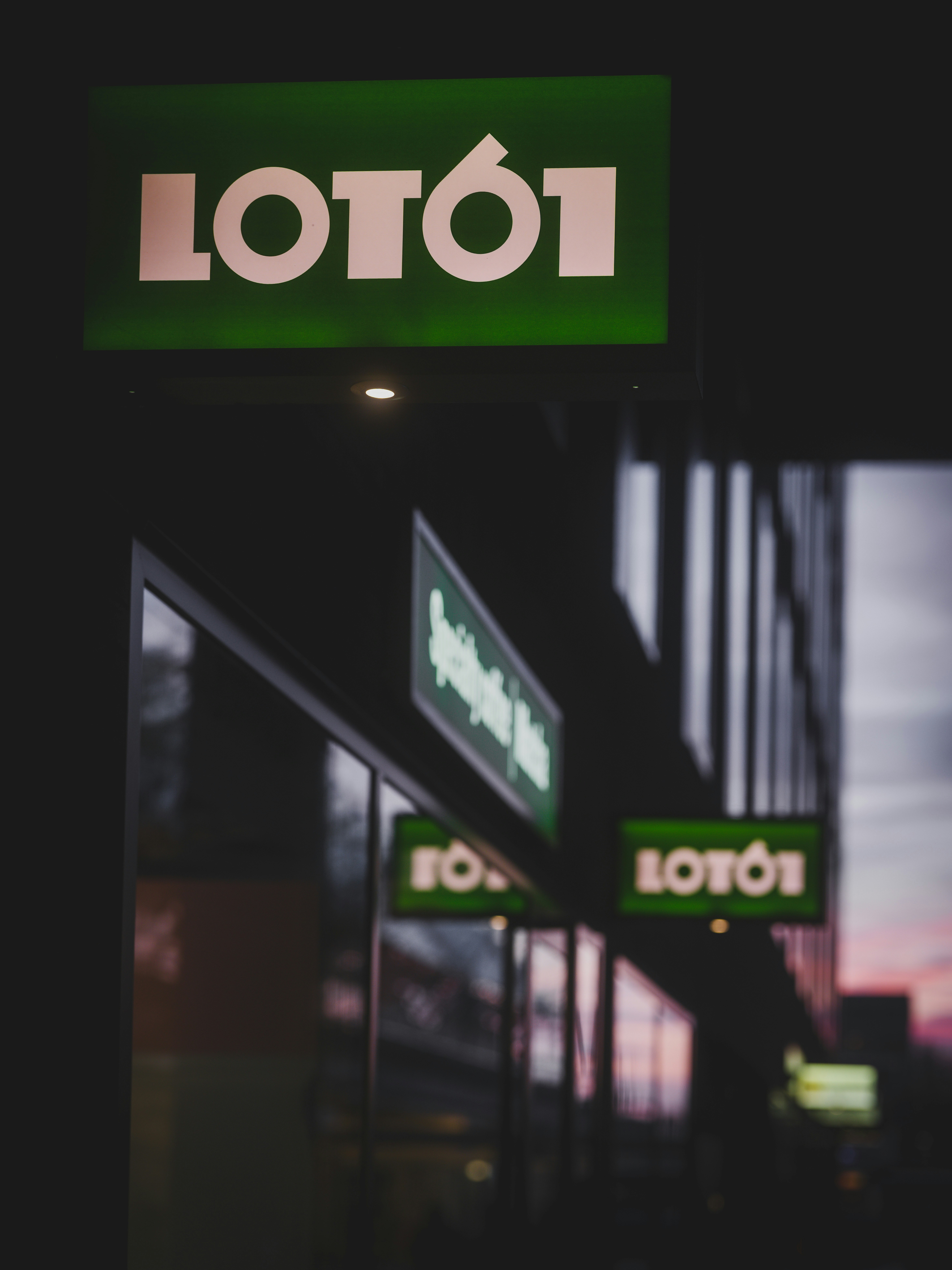 Green Lotto1 Signover in a Dim Street Scene