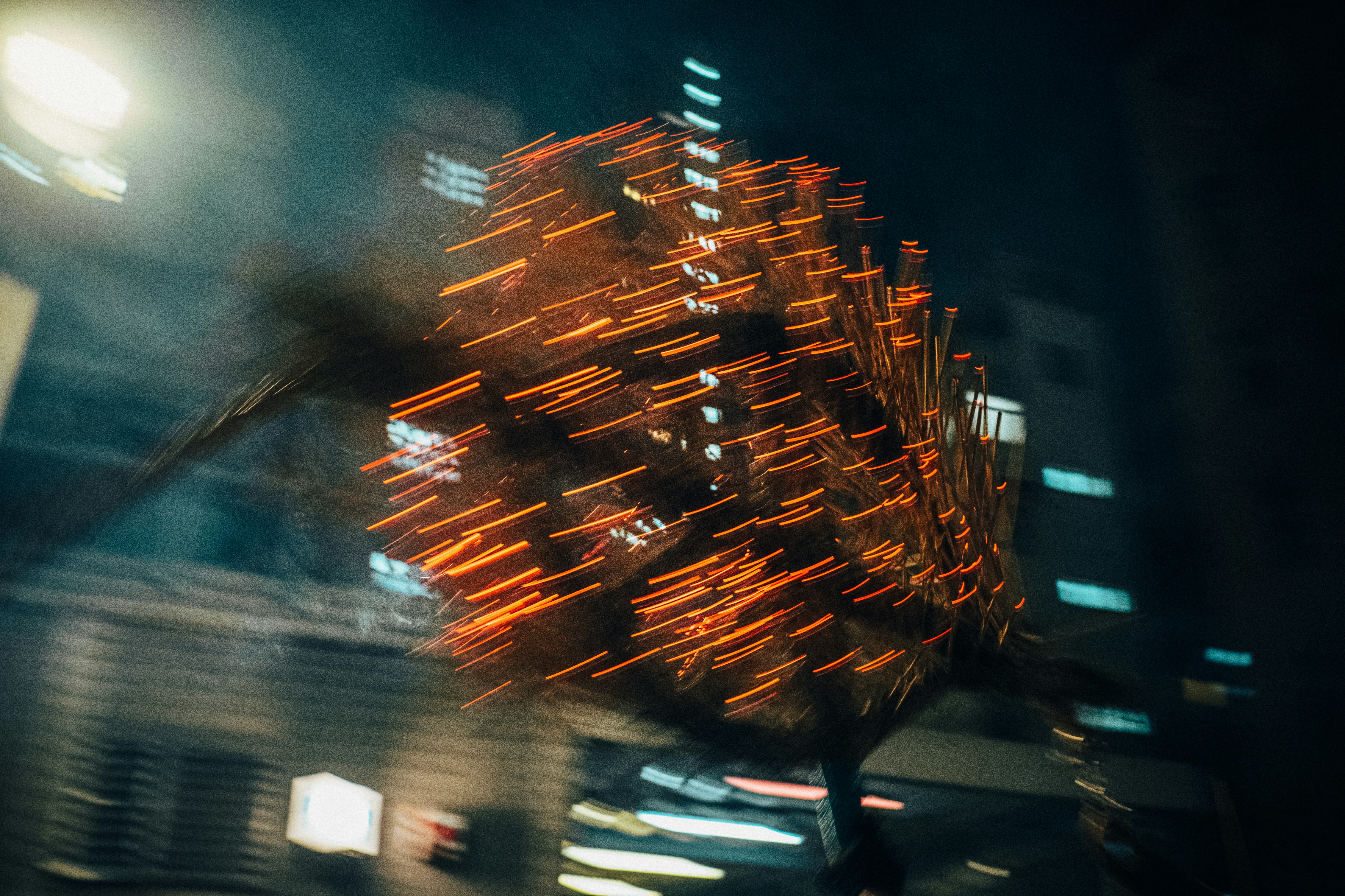 Blurry Ember Dervish: Motion of Firelight in Night City