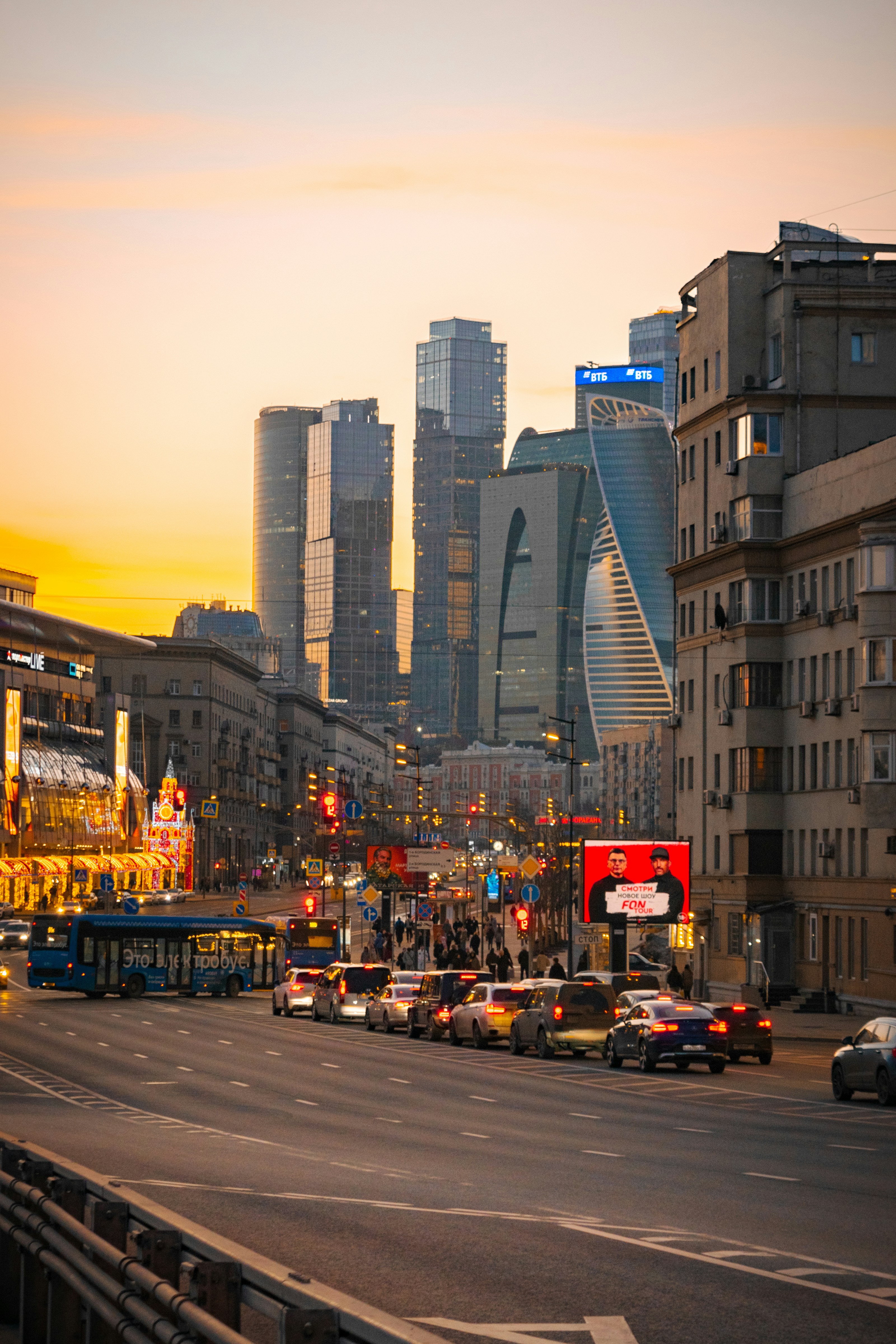Golden Hour Corridor: Cityscape Through a Bustling Street