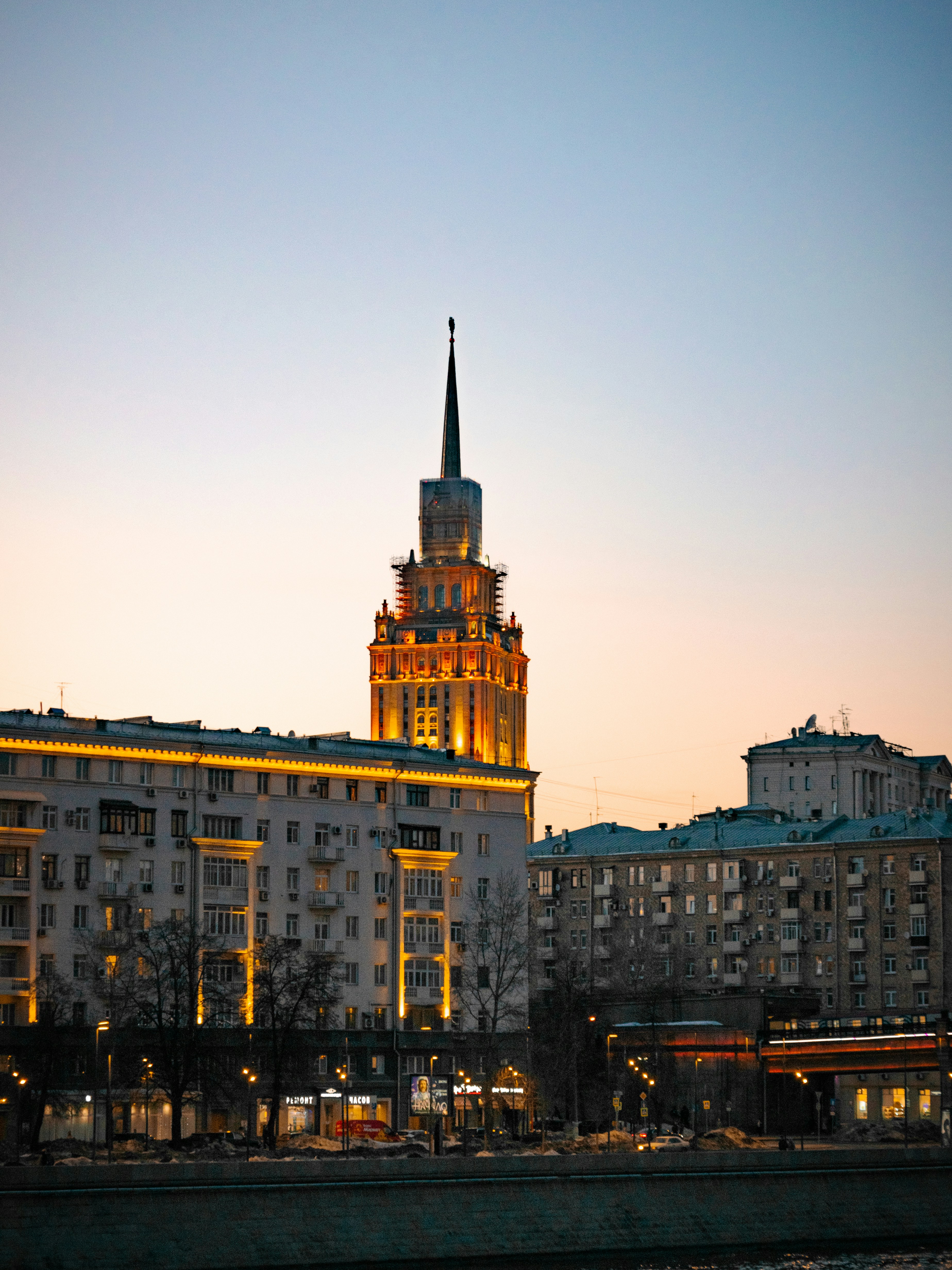 Evening Spire: A City Clocktower Rising Above the Riverside